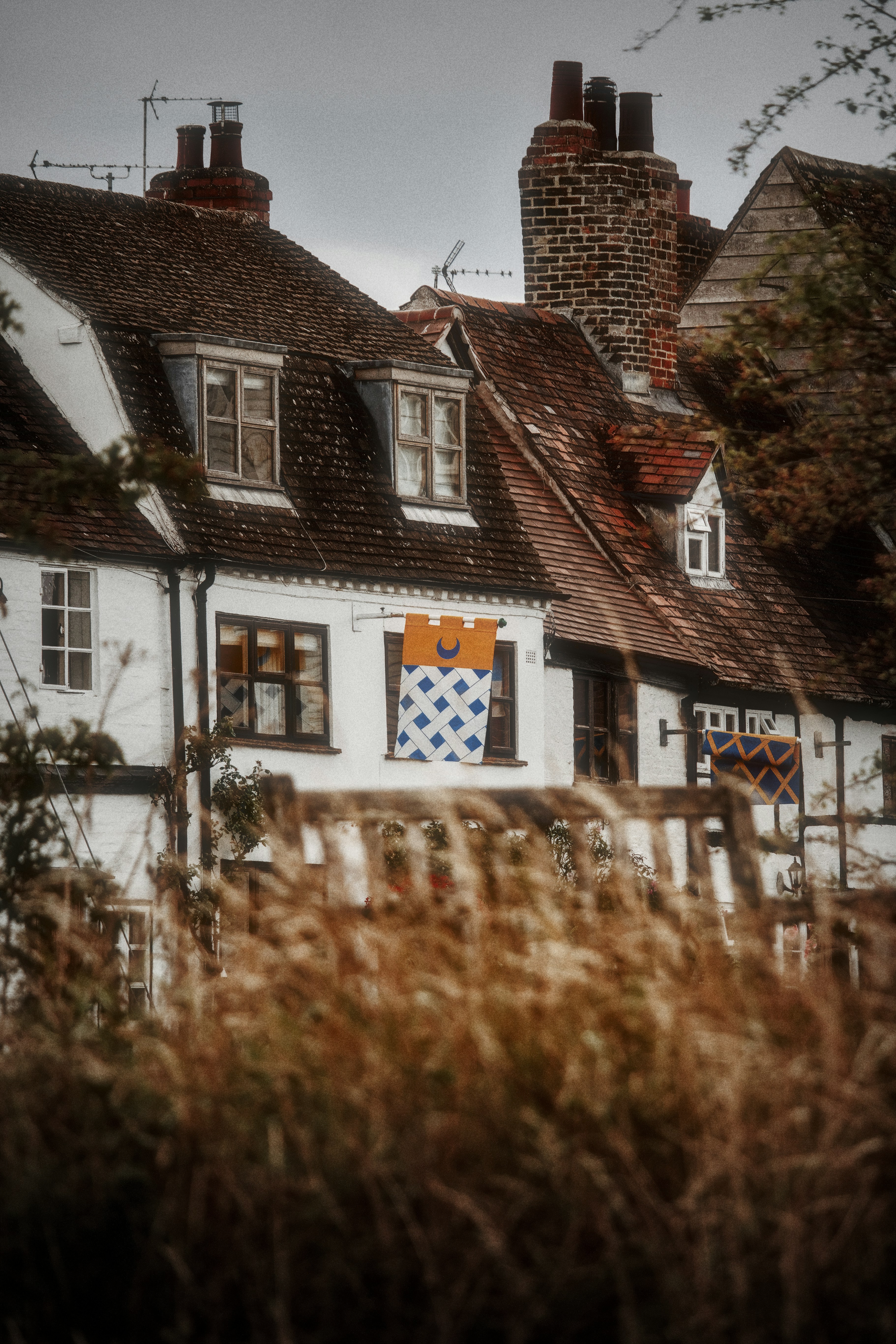 Old houses with dormers and chimneys are visible.