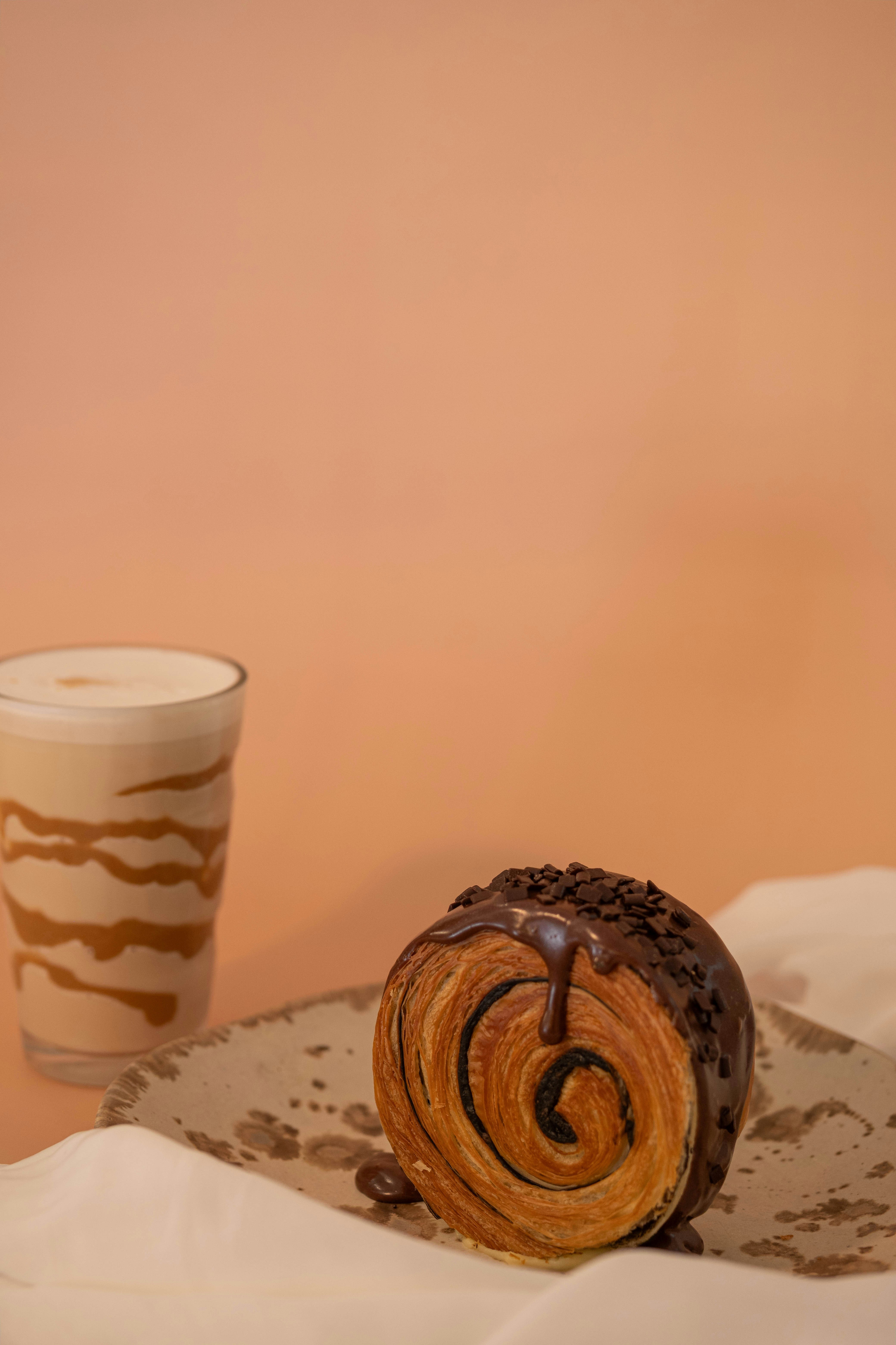 Chocolate pastry and latte with a neutral backdrop. photo – Free Food ...