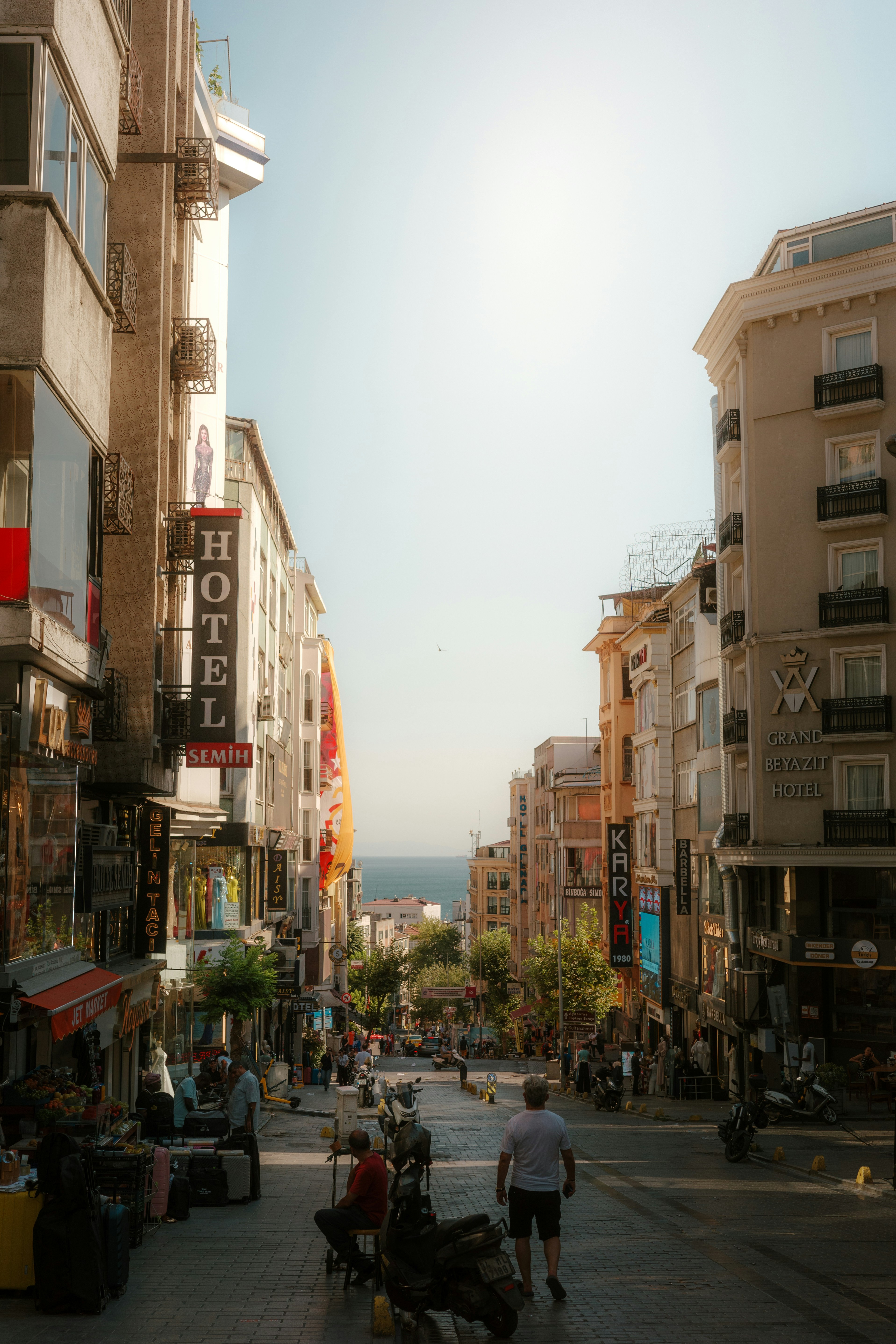 Urban street with hotel signs in a city.