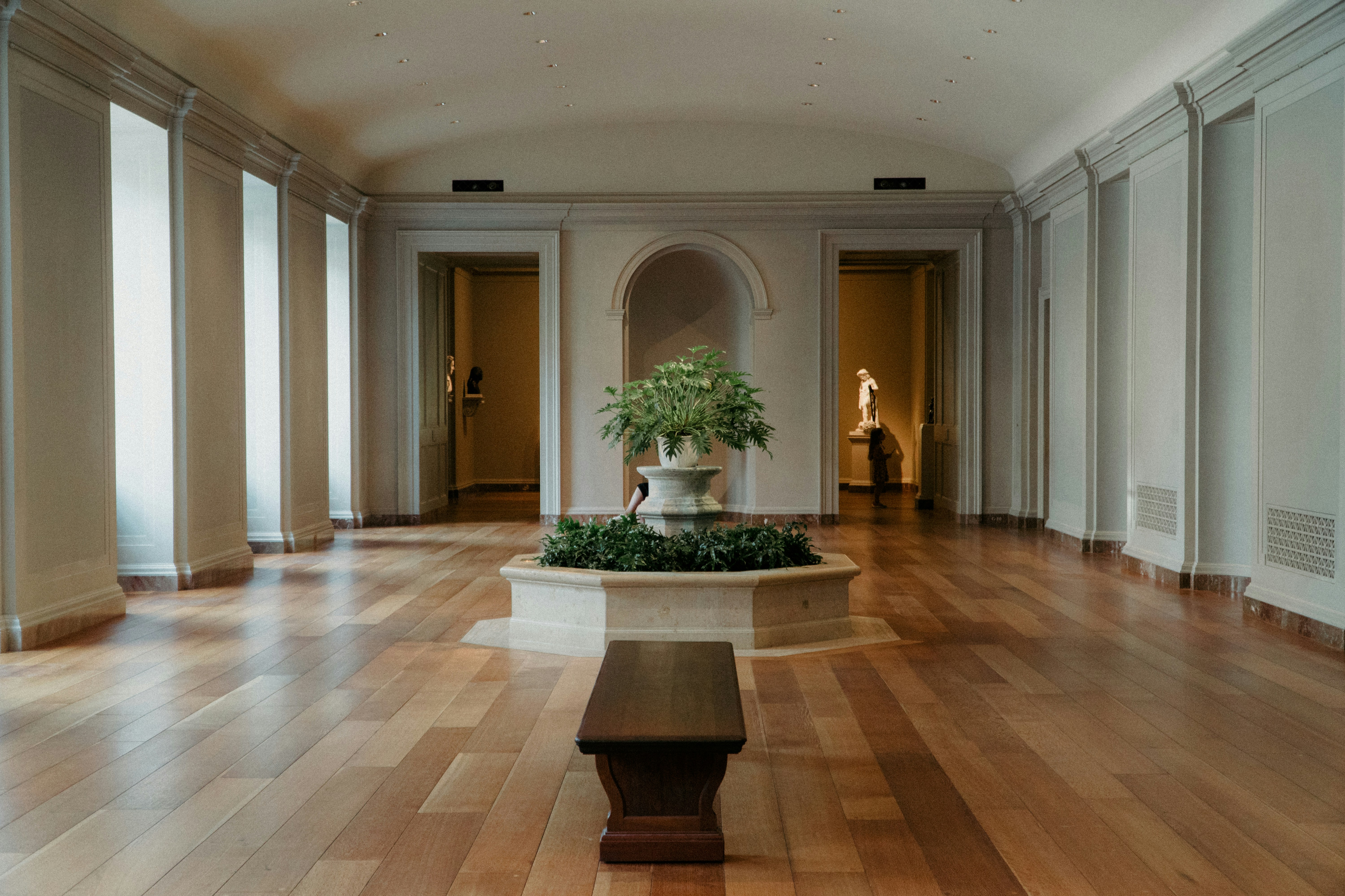 A beautifully designed hallway features a fountain.