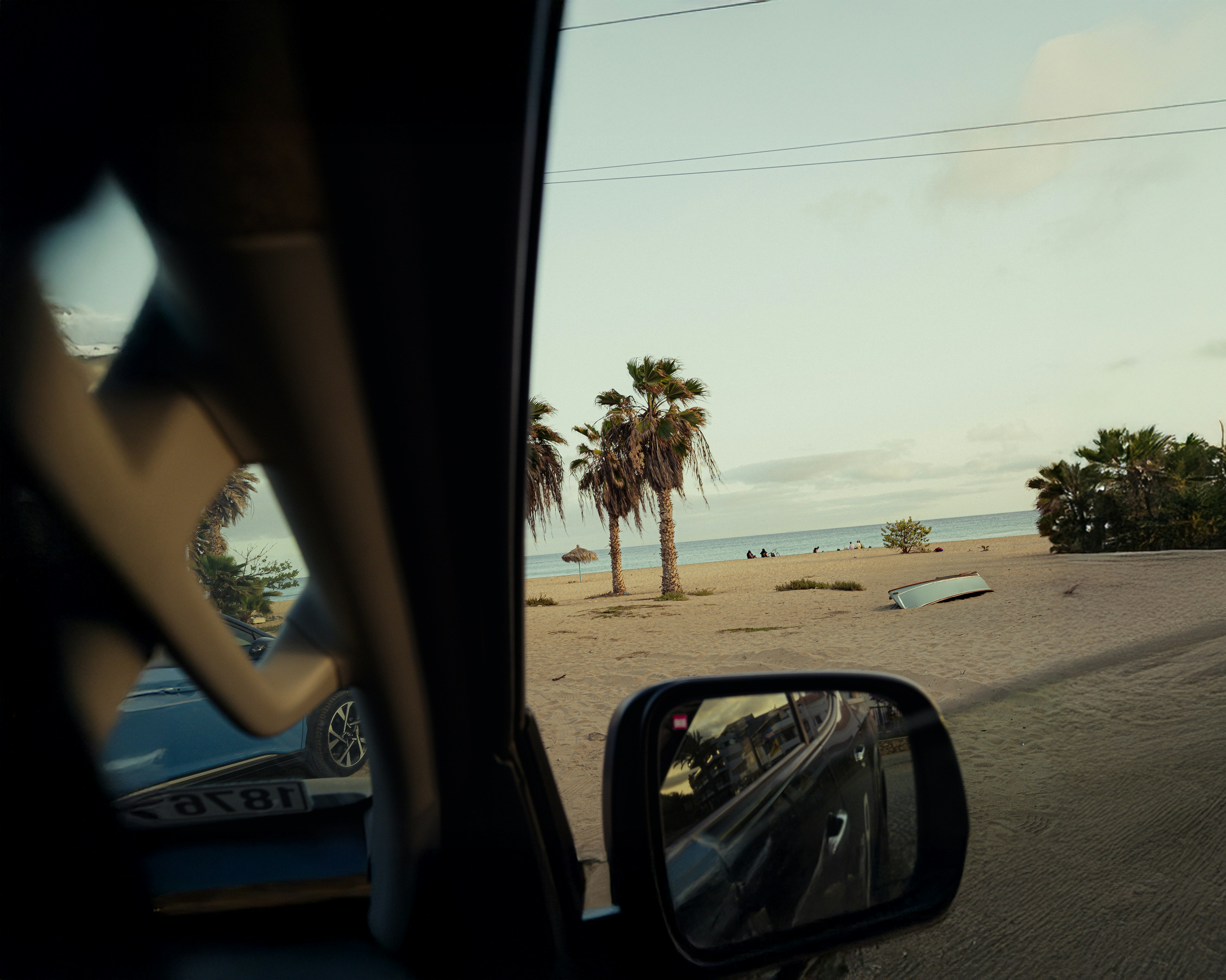 Serene Coastal Glimpse from a Car Window