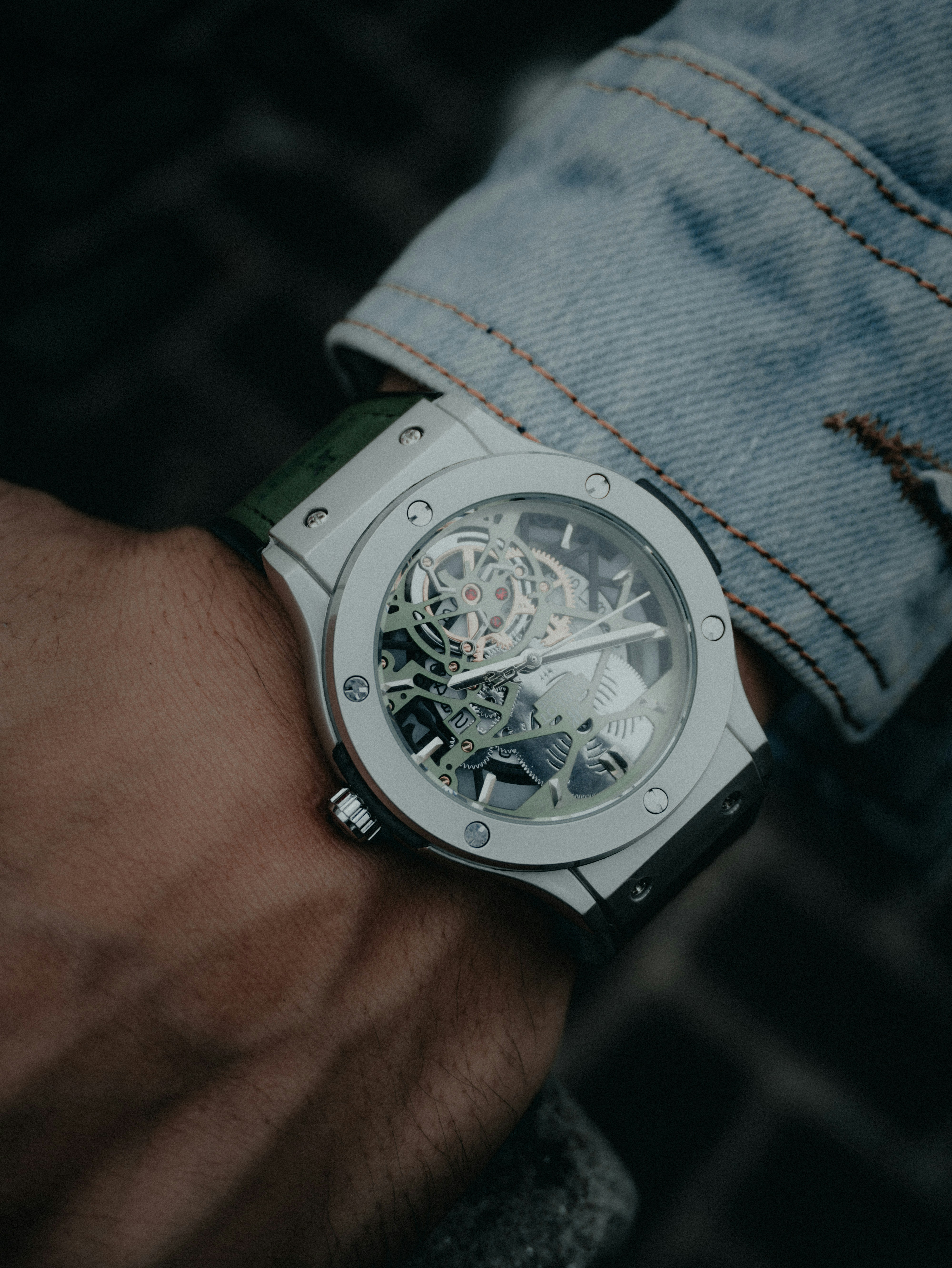 A luxury watch is shown on a wrist.