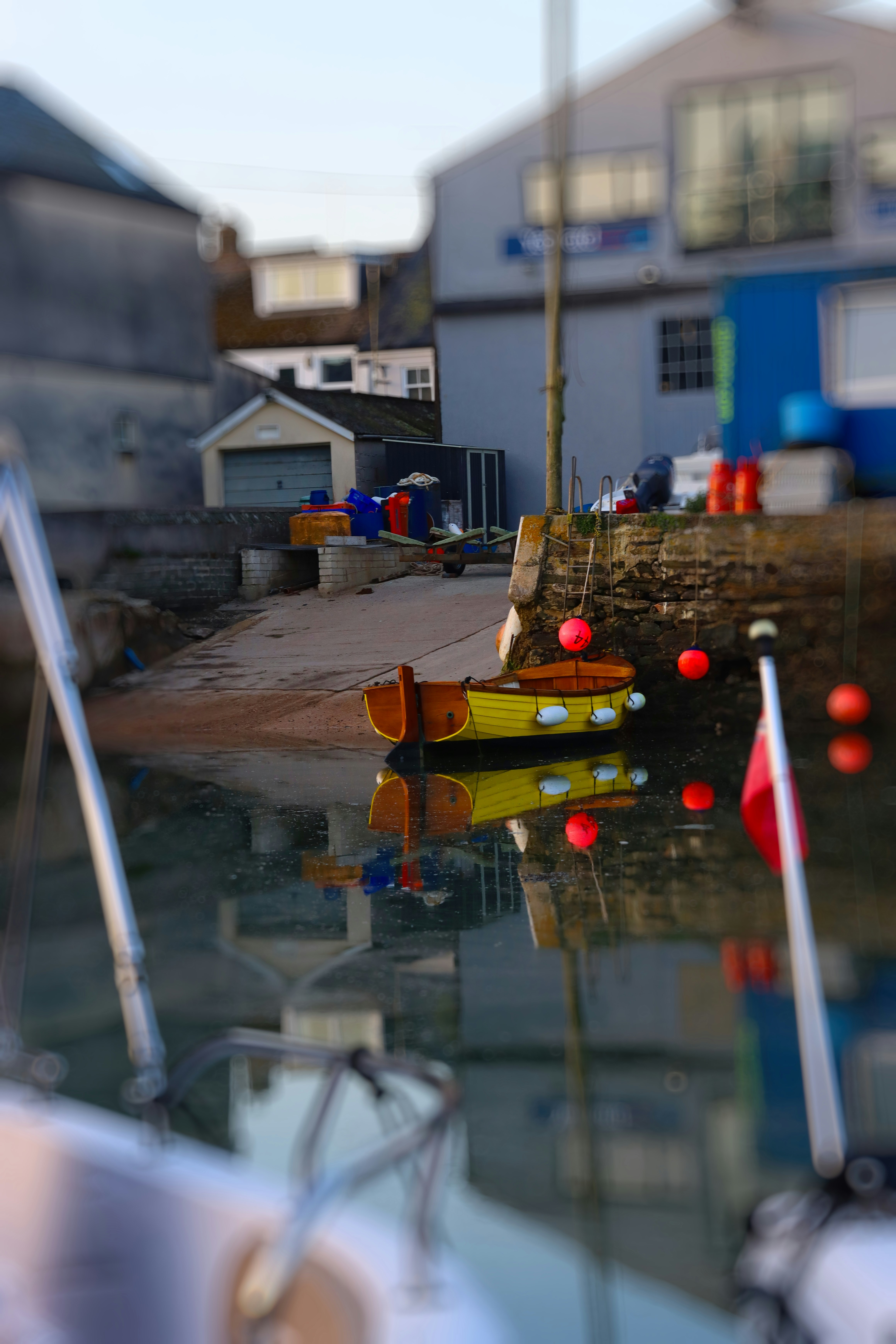 Harbor Serenity: A Yellow Craft's Reflection