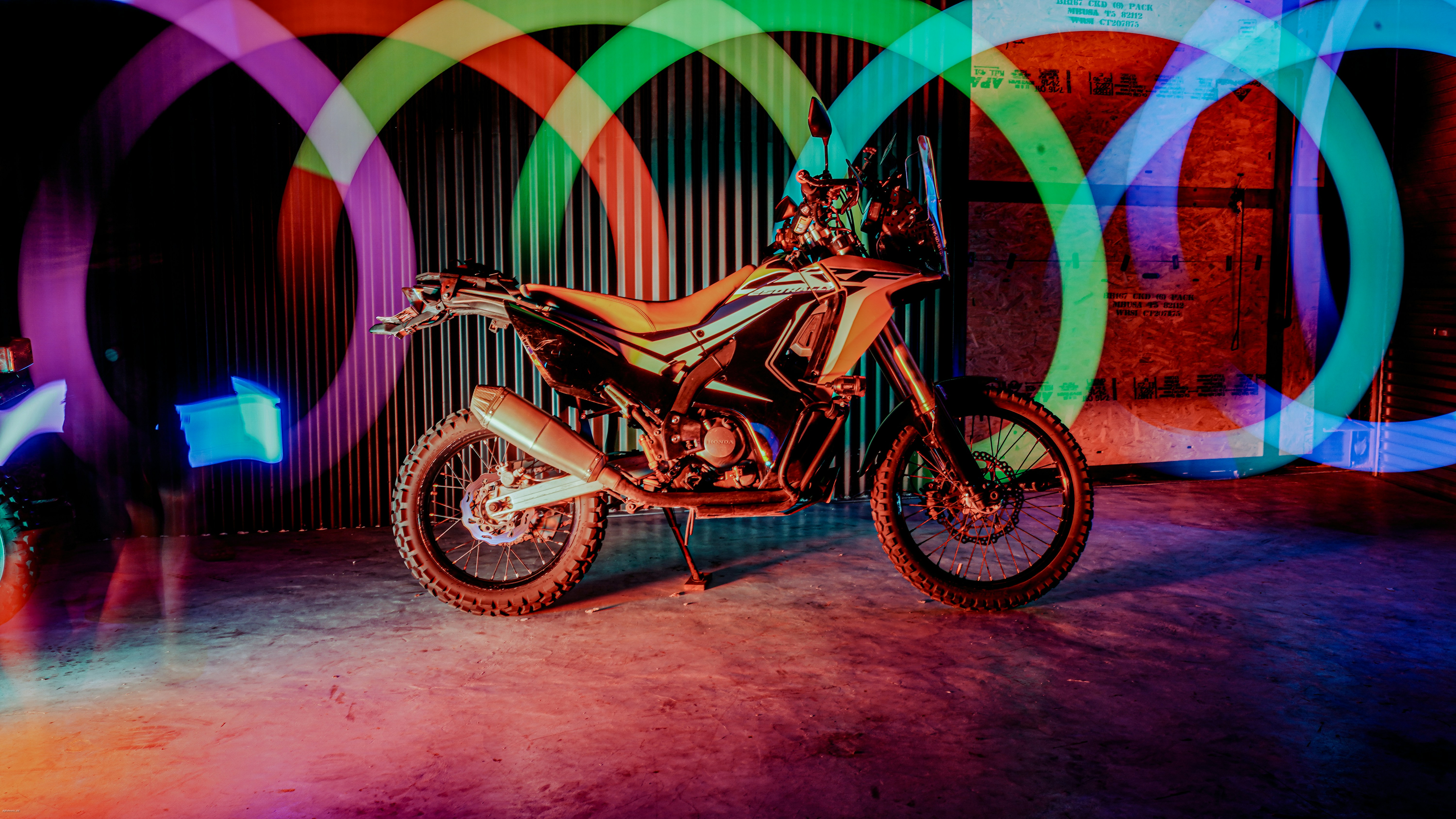 Motorcycle Light Painting Photography | A motorcycle with vibrant light trails is shown.