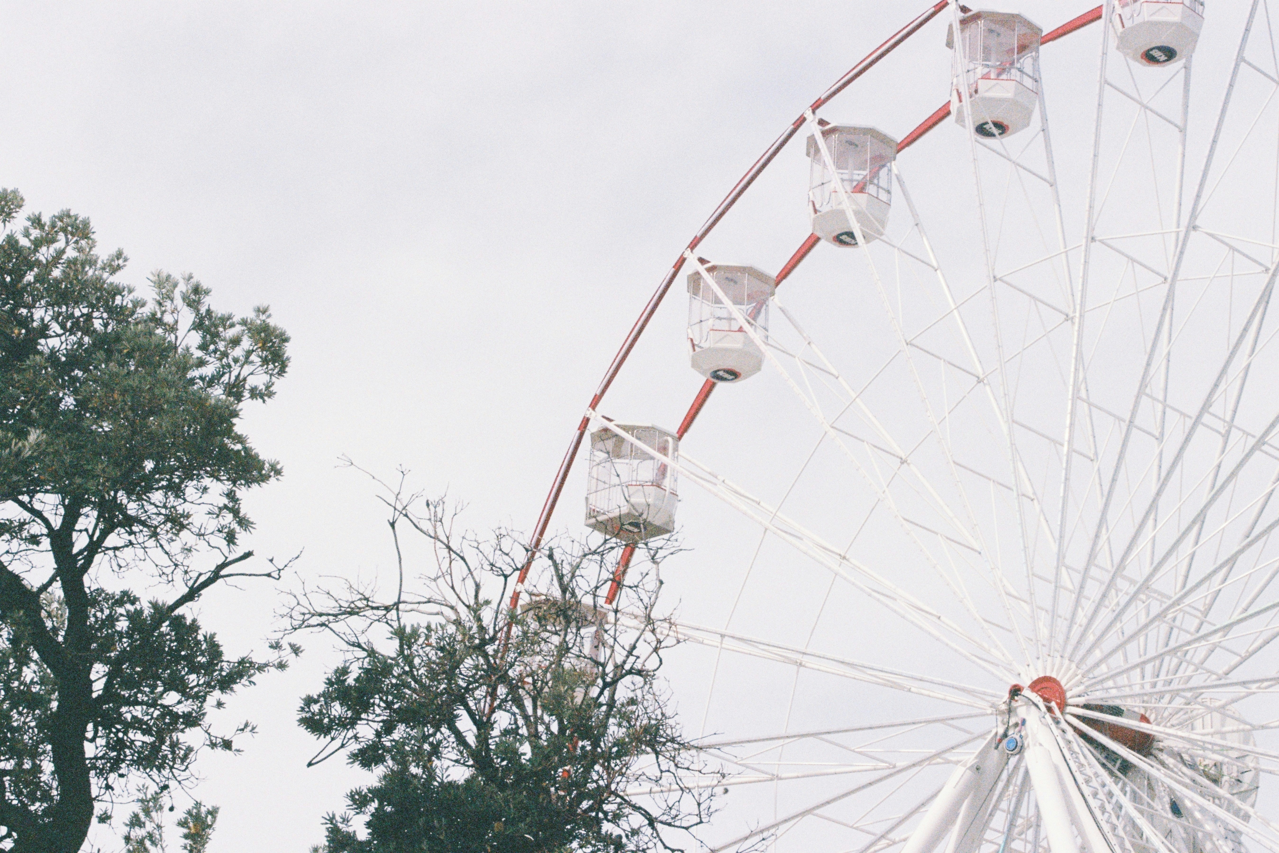 Ferris Wheel in St Kilda, Melbourne | A ferris wheel against a cloudy sky.