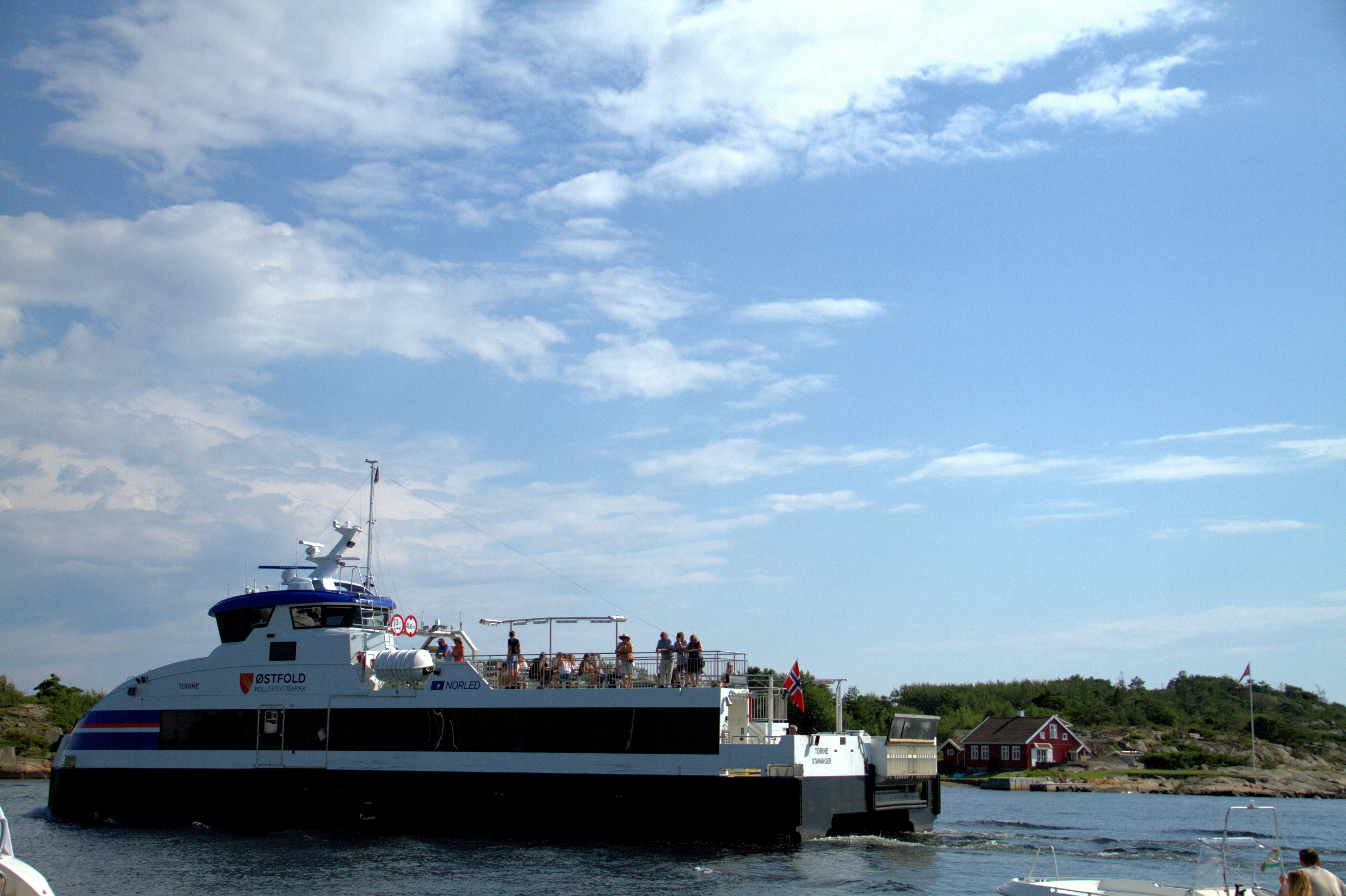 A ferry boat sails on a sunny day.