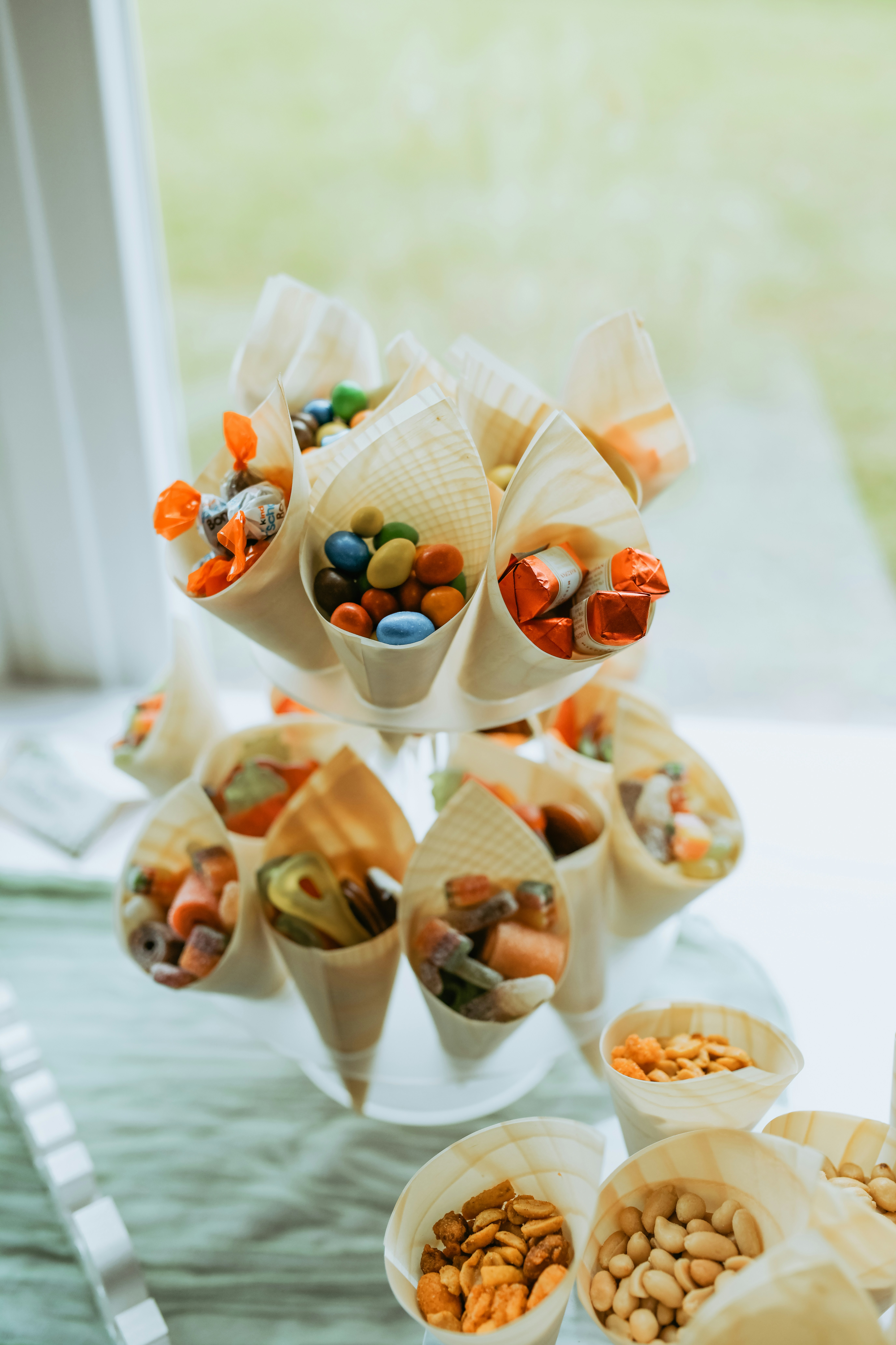 Candy cones are presented on a tiered display.