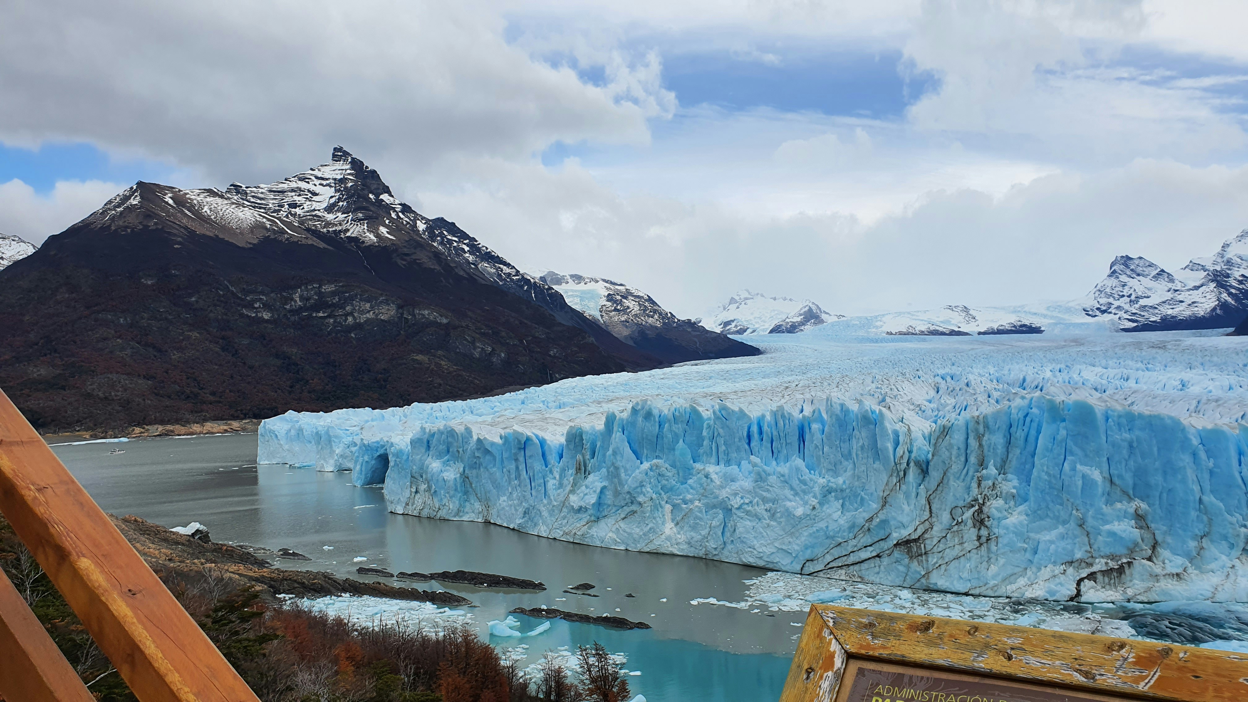 A beautiful glacier reflects on the water.