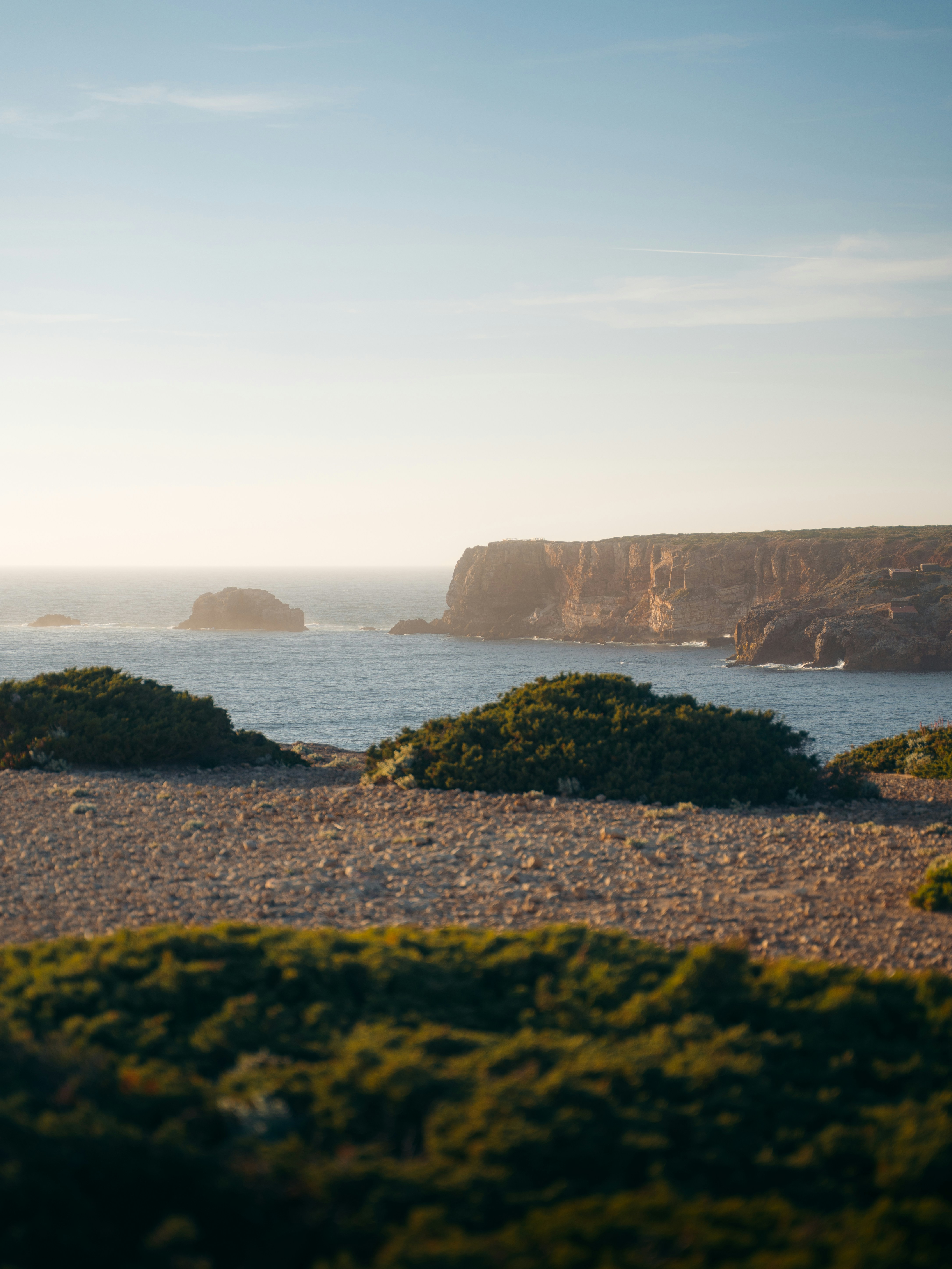 A scenic ocean view under a clear sky.