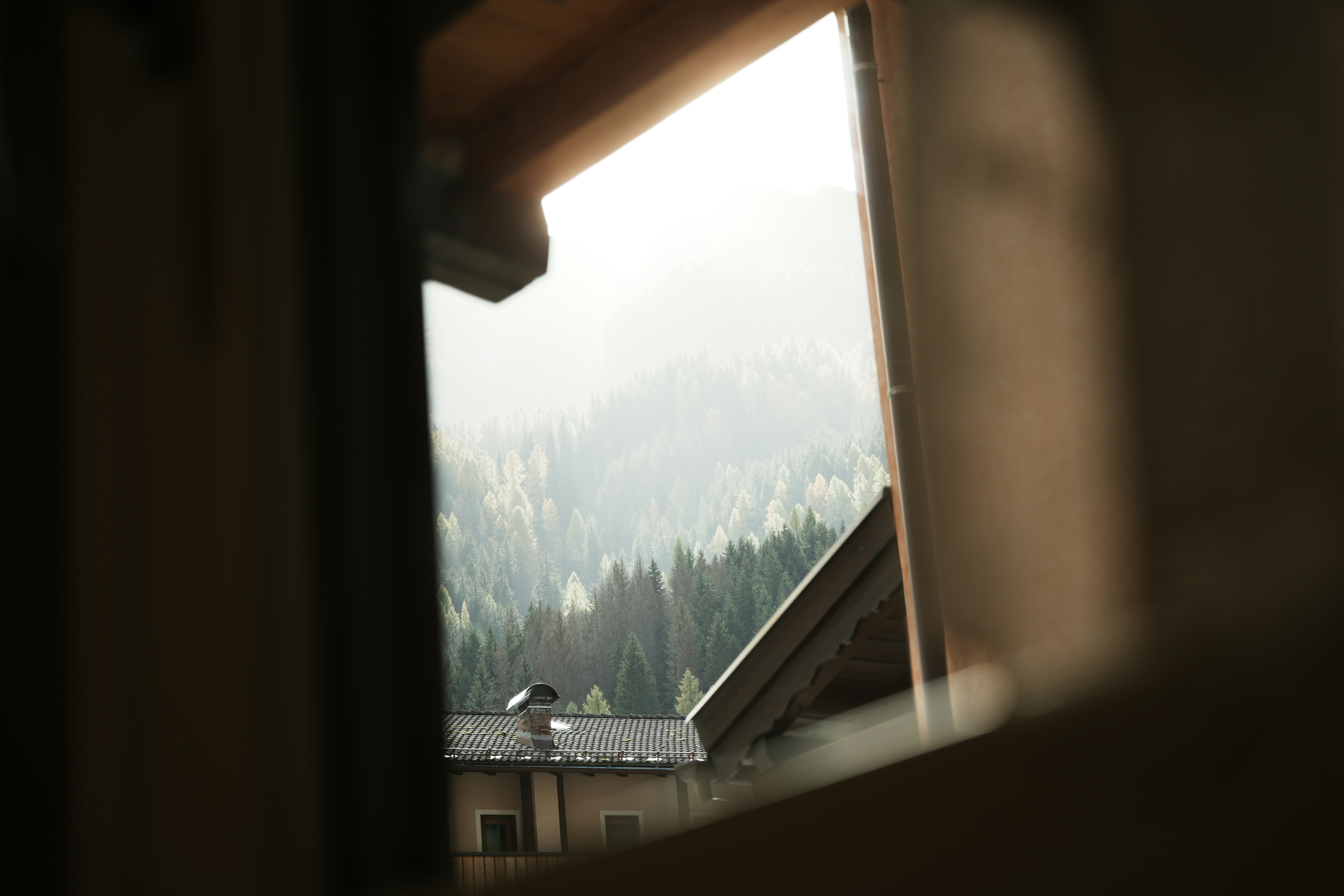 View of mountains framed by a window.