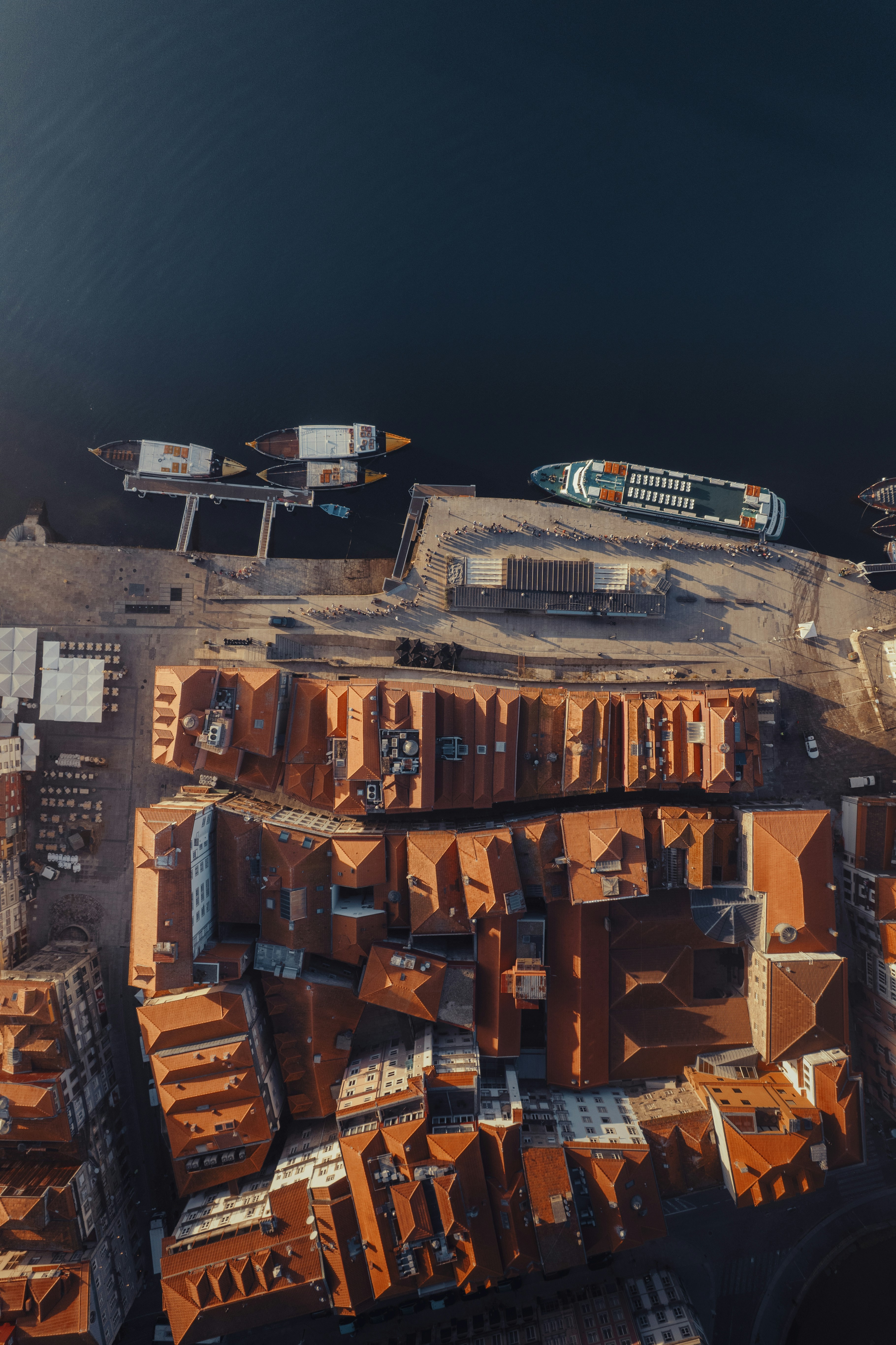 Aerial view of a city bordering a body of water.