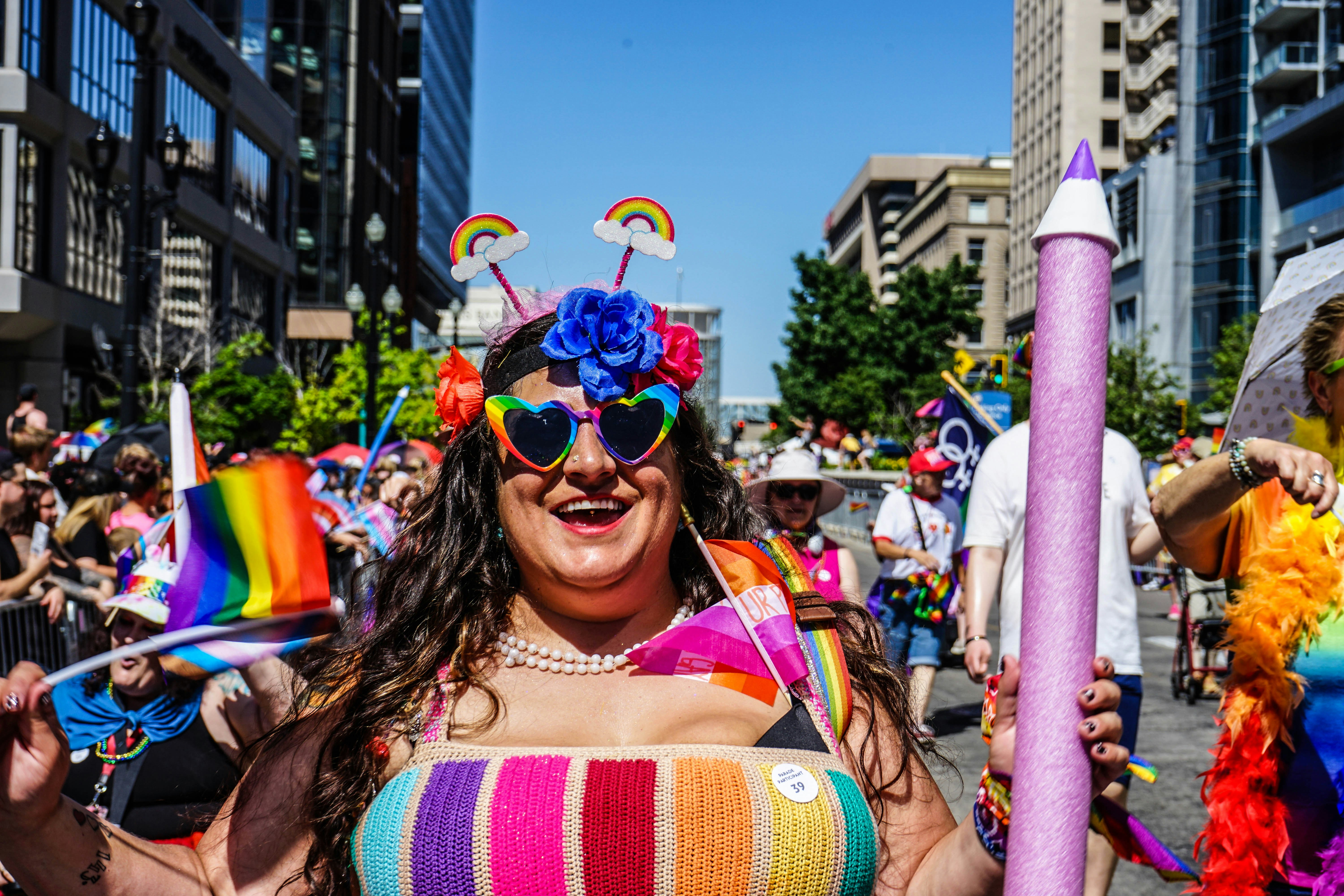 People celebrate pride with colorful outfits and flags. photo – Free ...