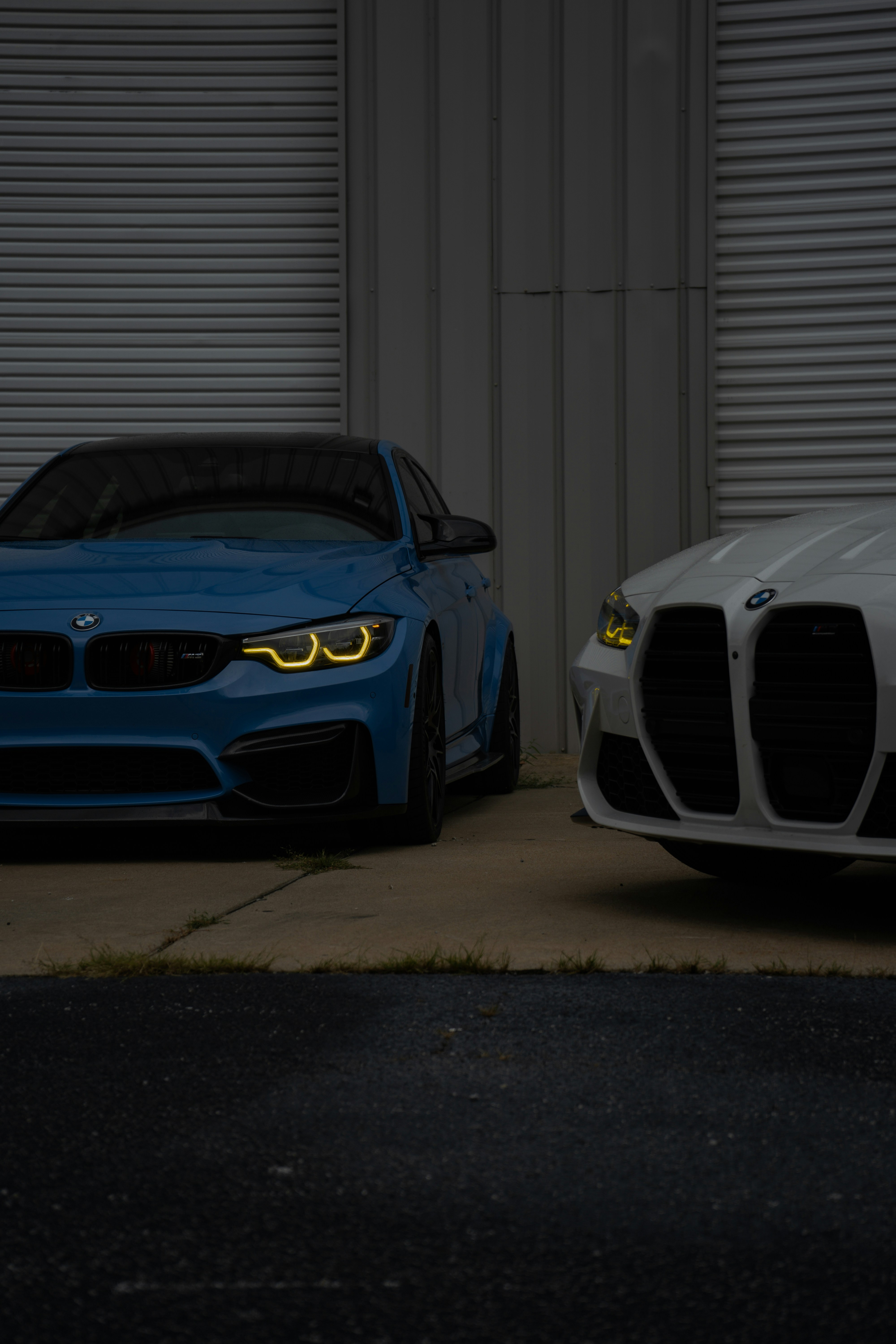 Blue Shadow, White Rival: A Quiet Garage Portrait of Twin BMWs