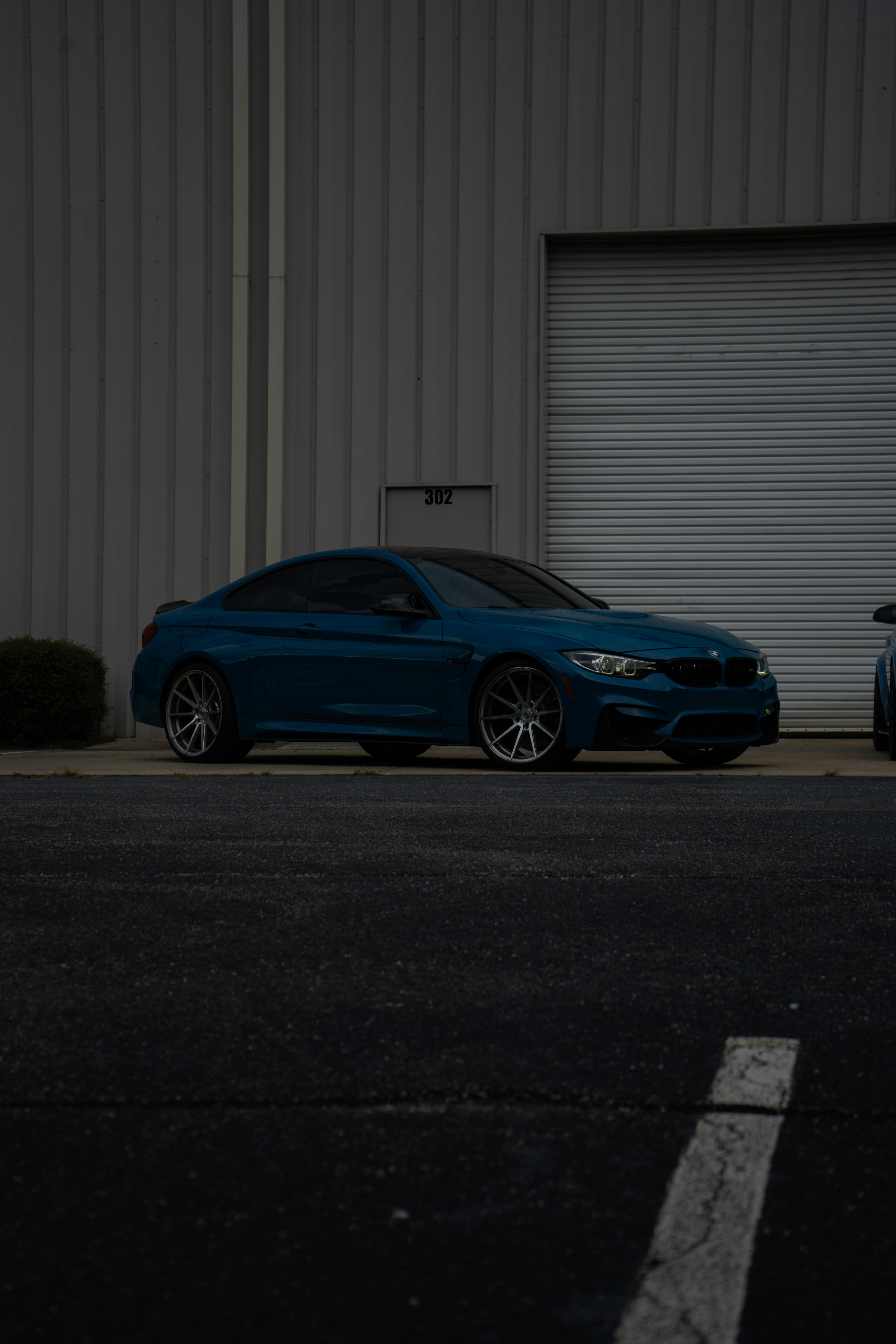Aqua Elegance: The BMW in Urban Shadows