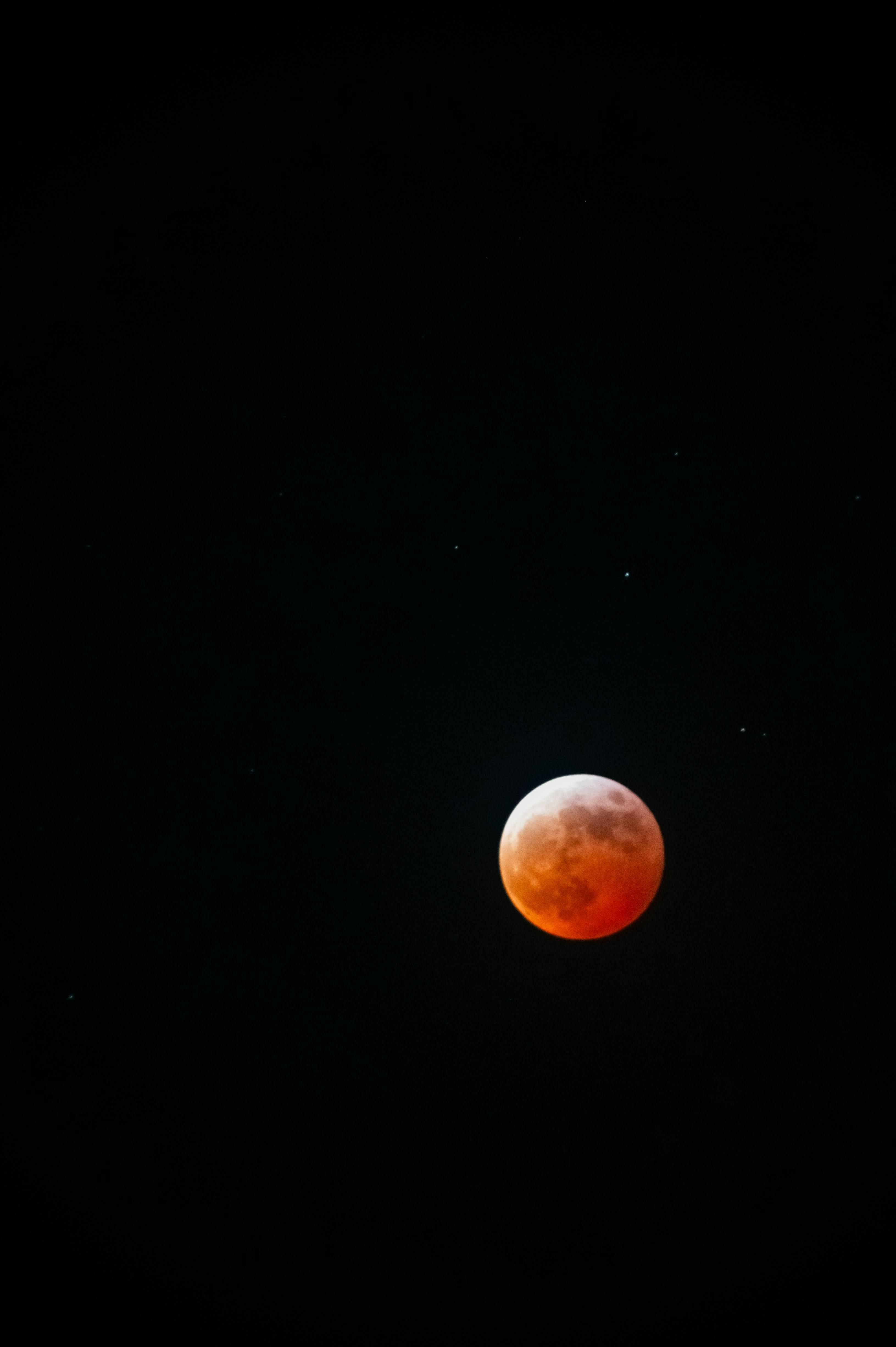 Celestial Ember: The Moon's Fiery Transformation
