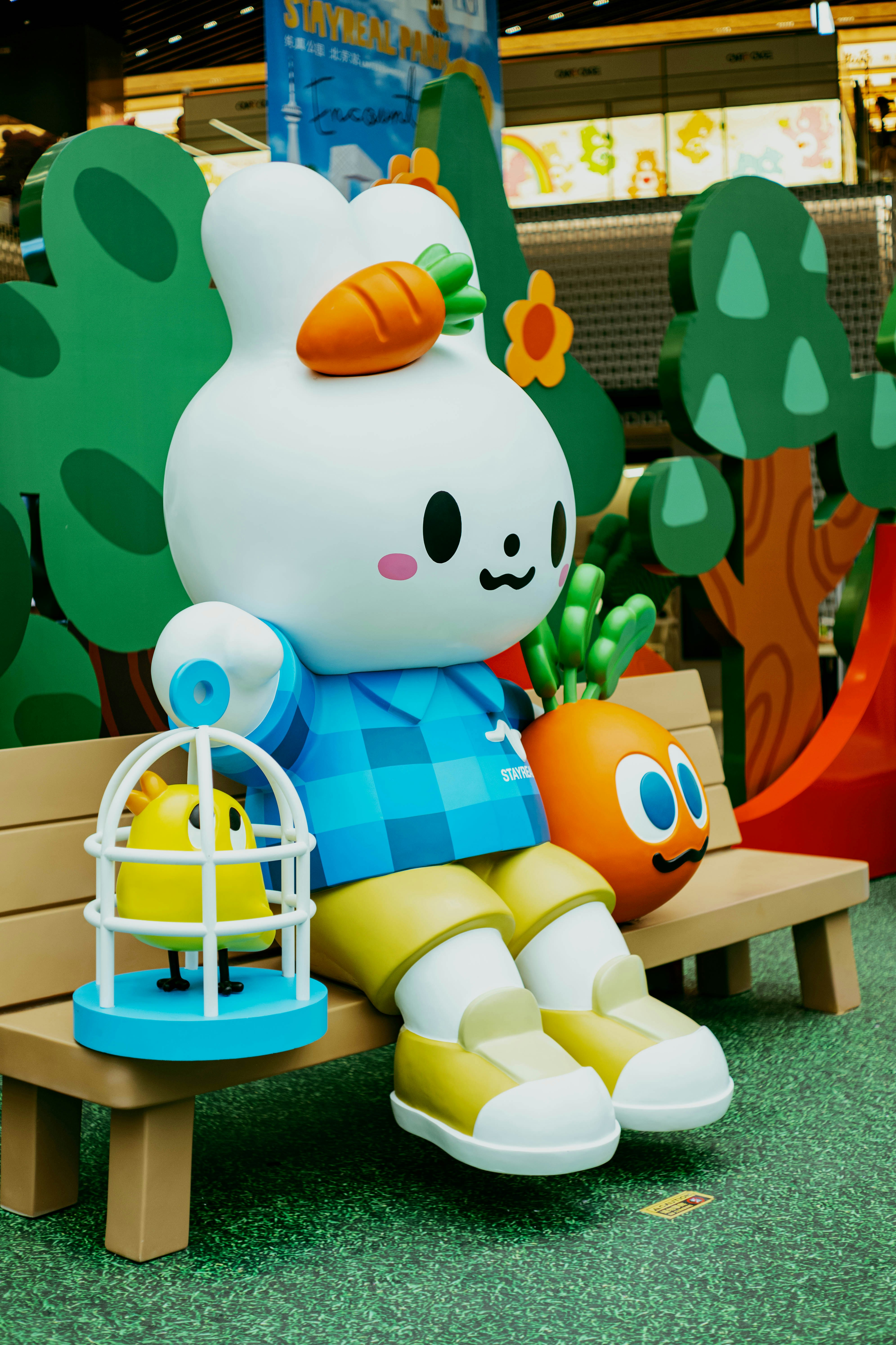 A cute bunny and friends sit on a park bench.