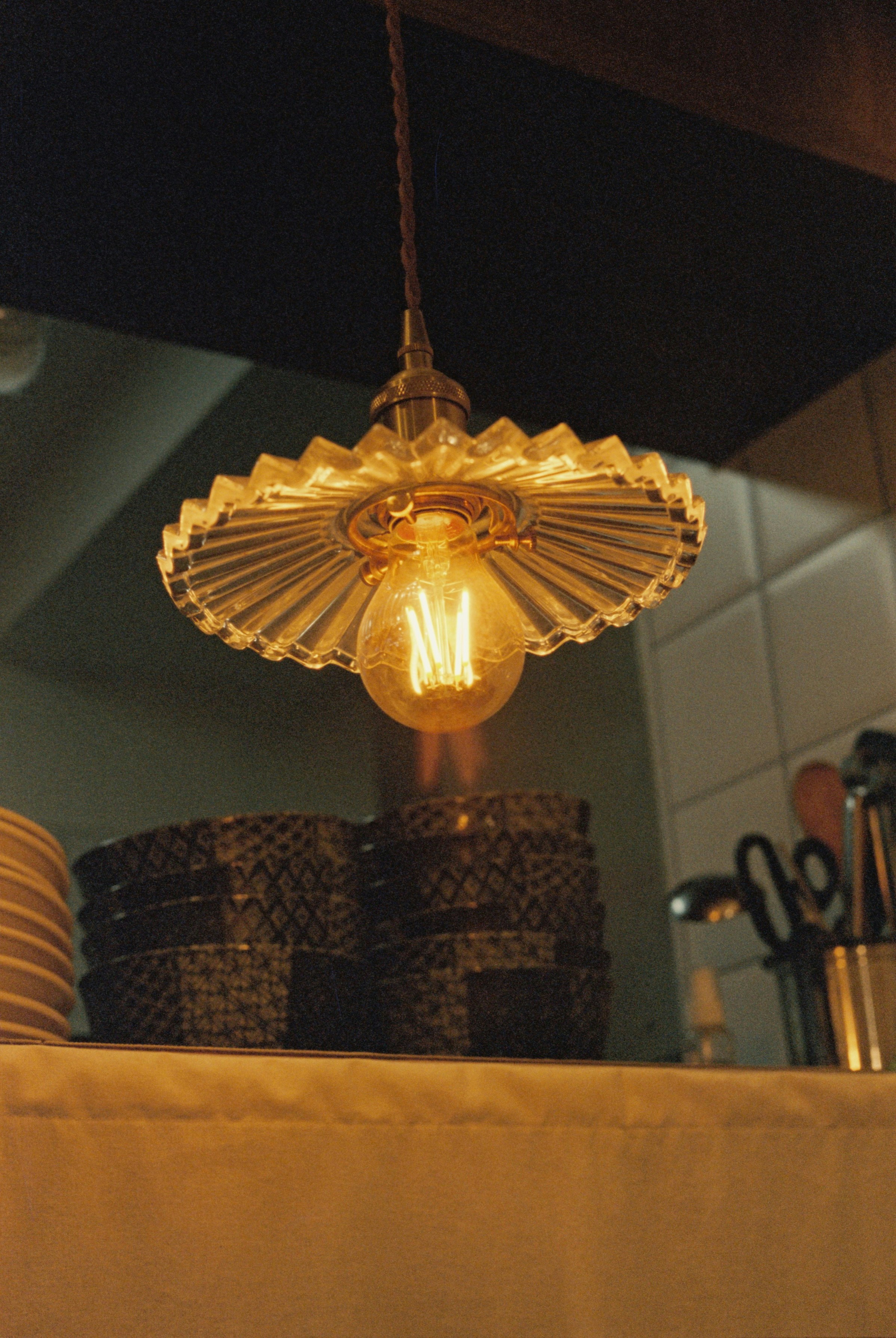 A decorative lightbulb illuminates a counter's contents.