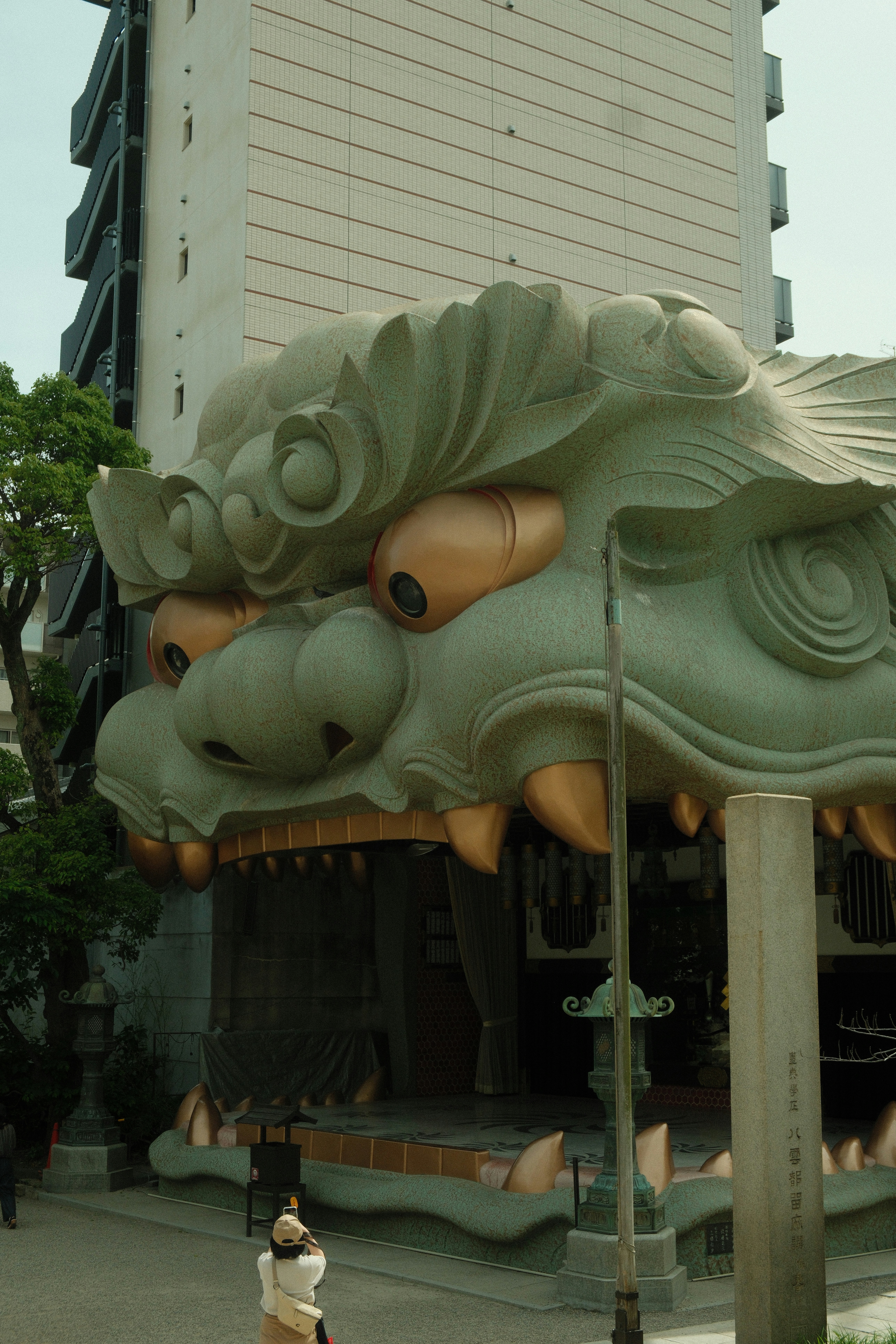 Dragon Gate: A Giant Sculpted Guardian Looms Over the Street