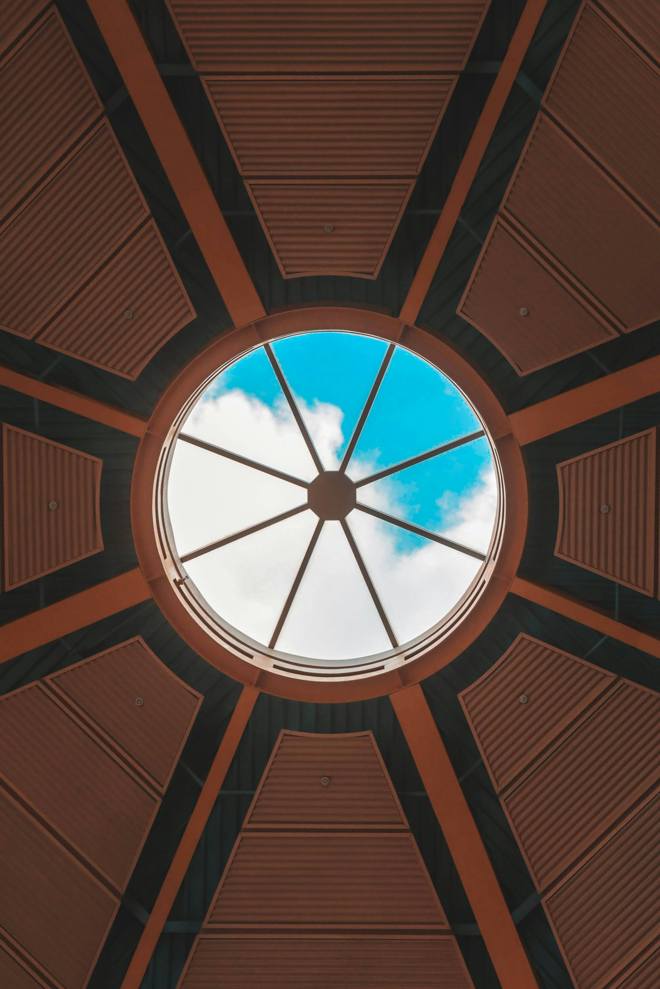 A round skylight looks up at the clouds.