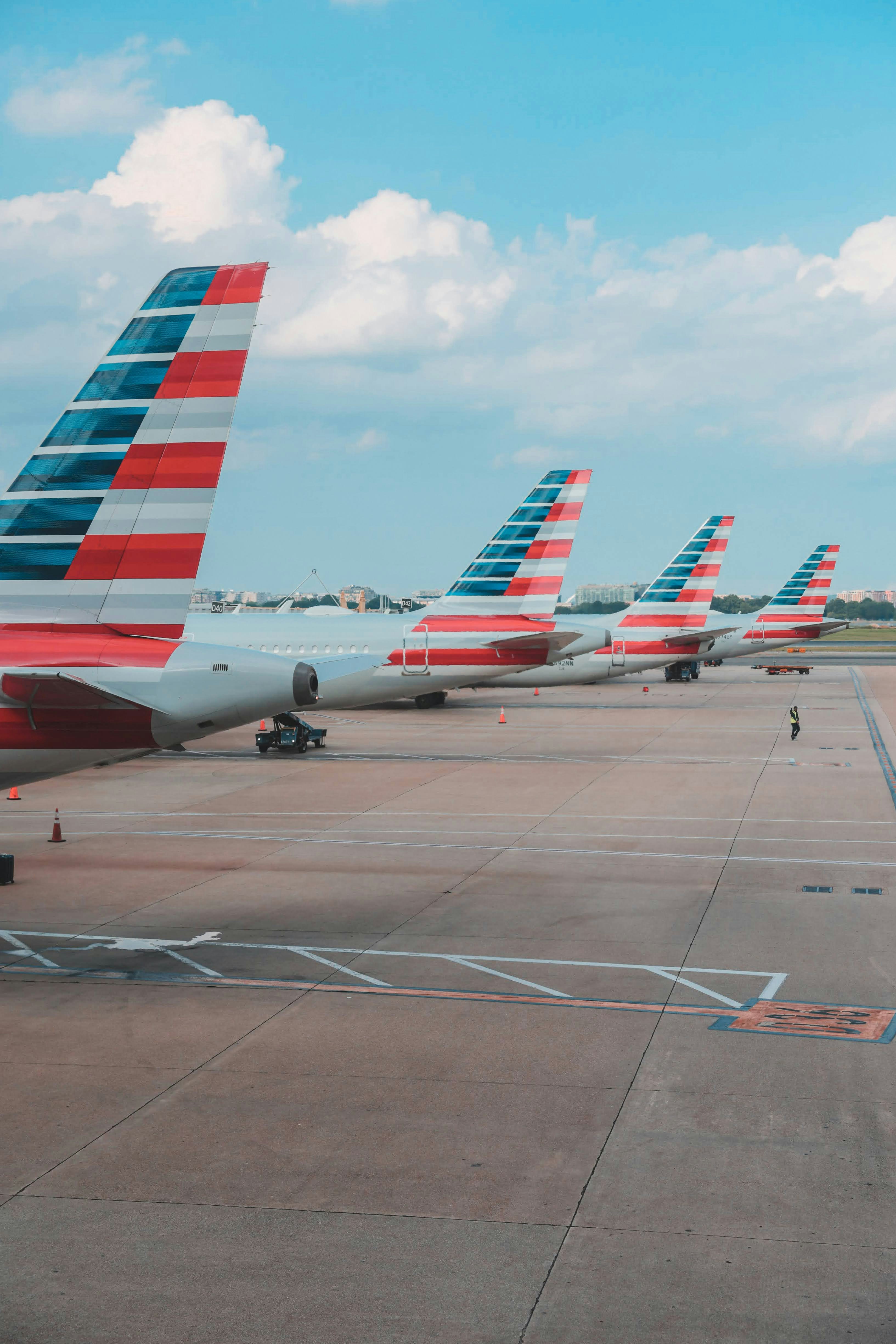 American airlines planes are lined up on the tarmac.