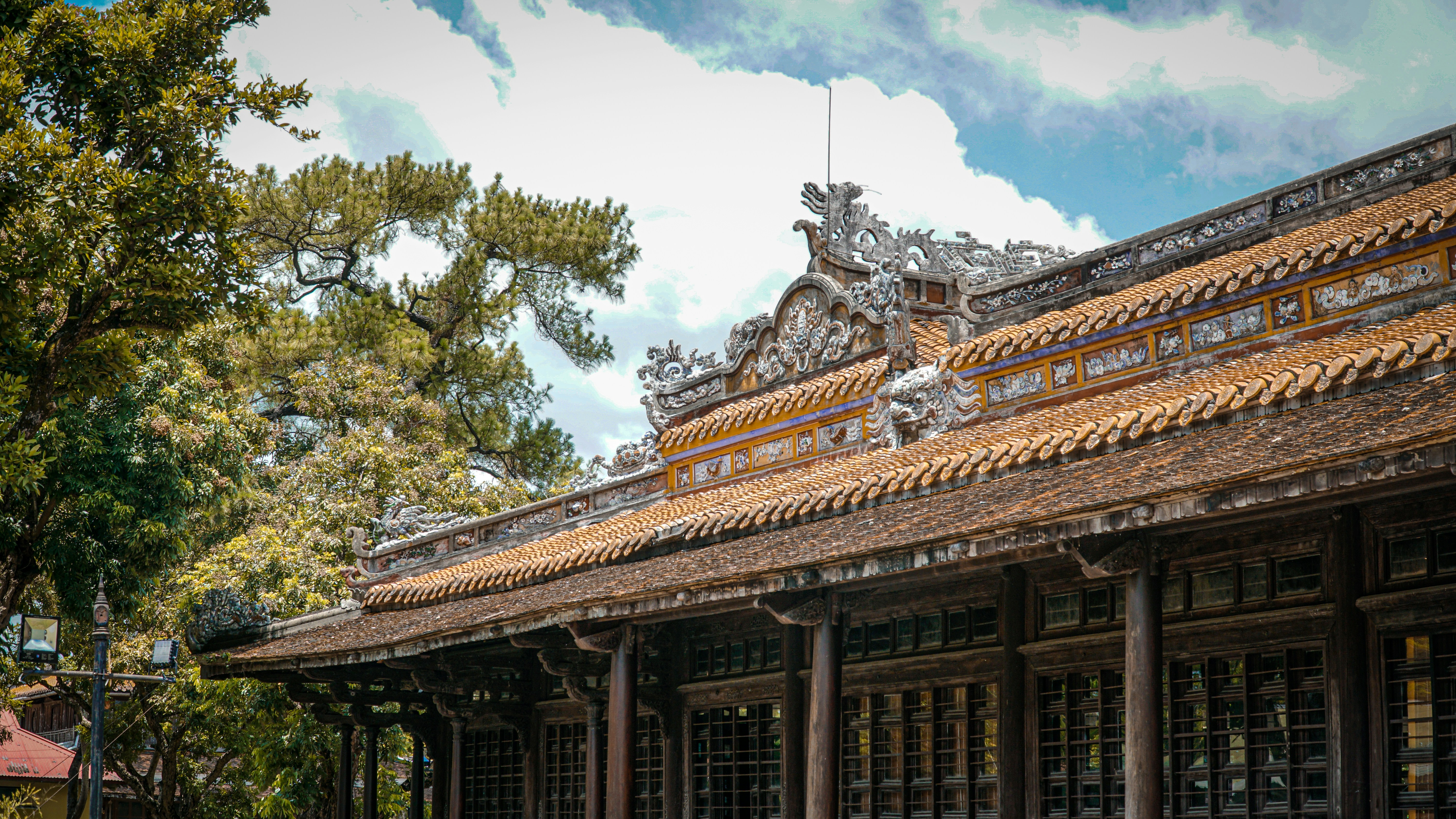 An ornate building sits under a cloudy sky.