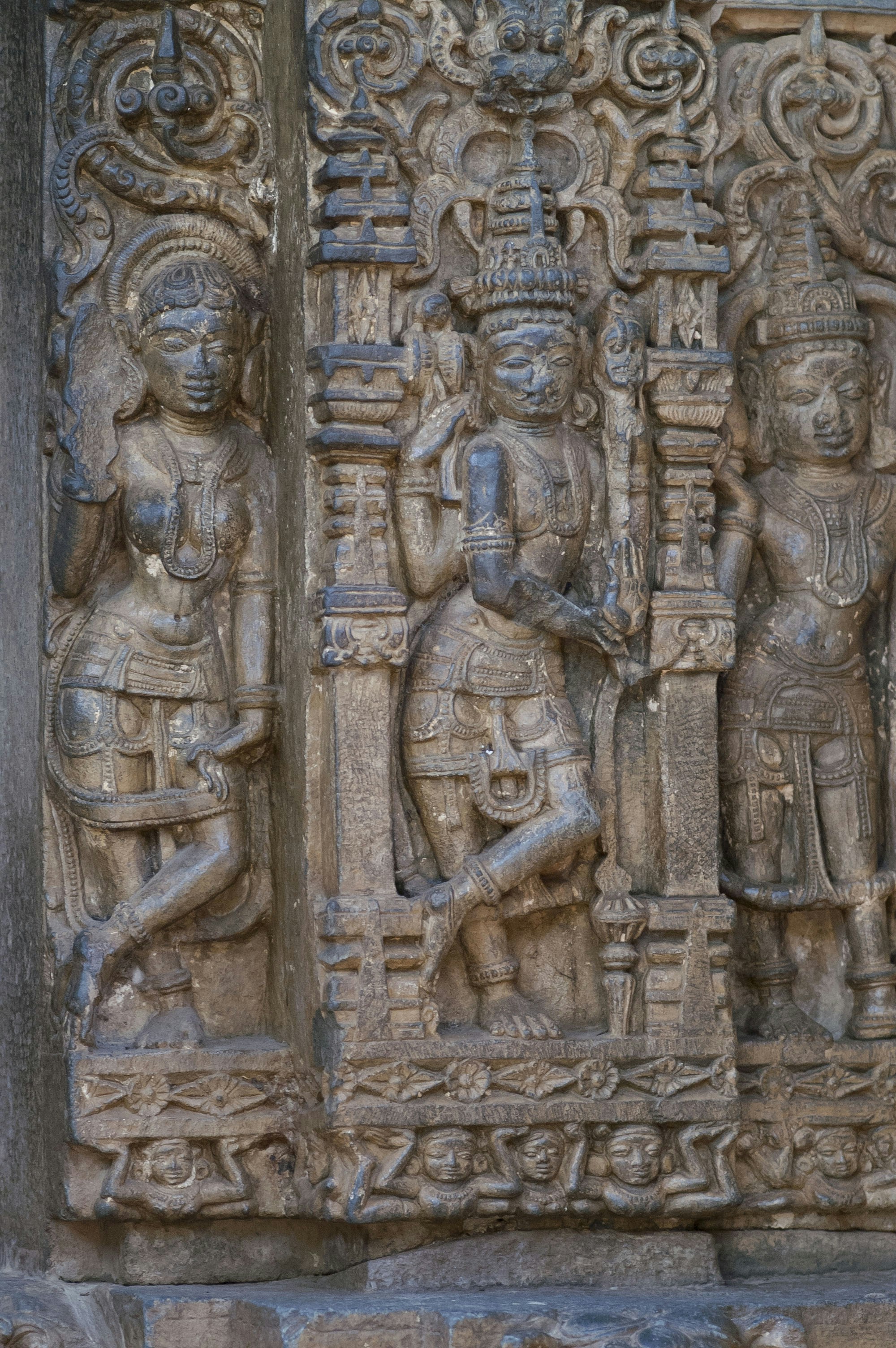 KONICA MINOLTA DIGITAL CAMERA | Sculpted stone figures adorn a temple facade.