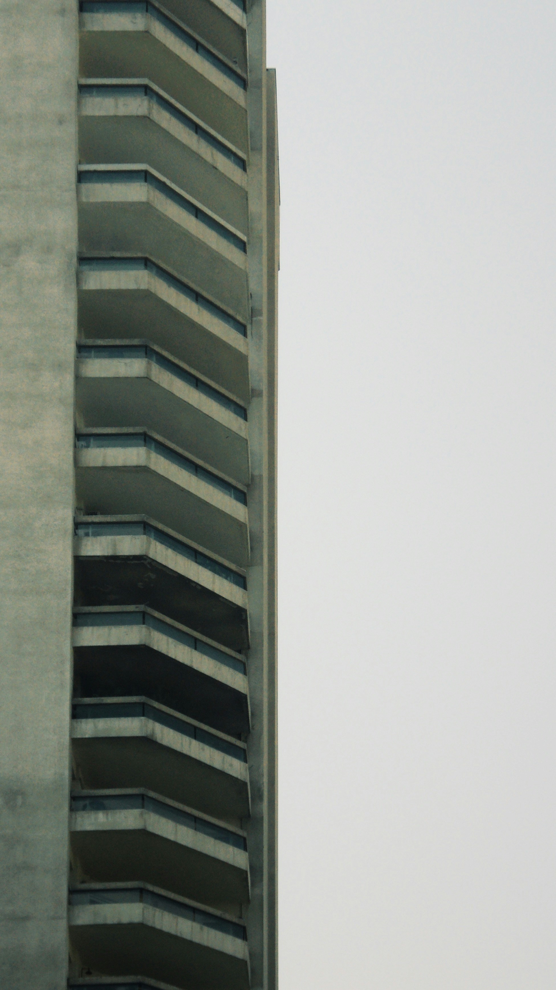 A hypnotic ascent. | Building with a zigzag pattern of balconies.