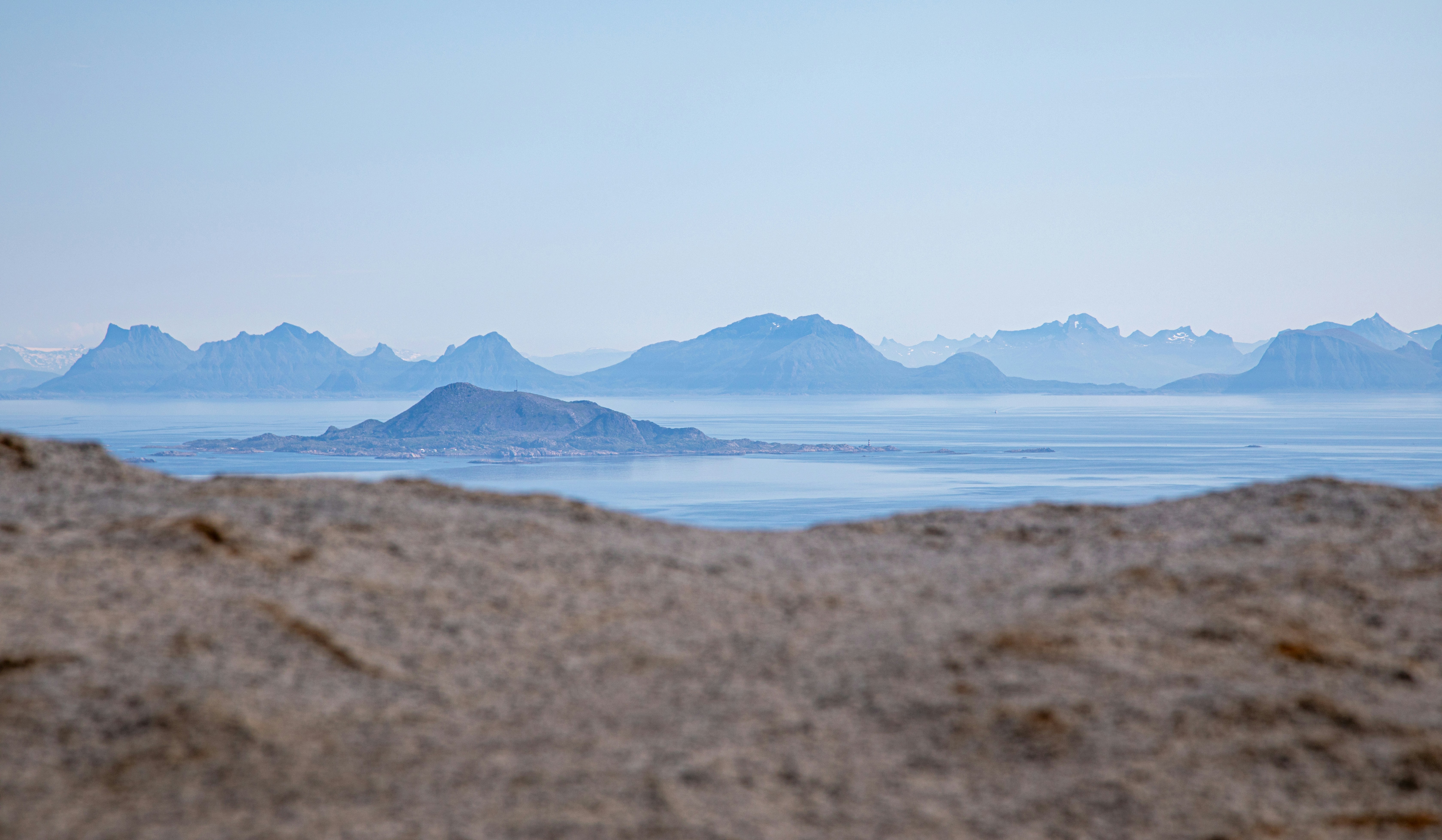 Hills and mountains are shrouded in a blue haze.