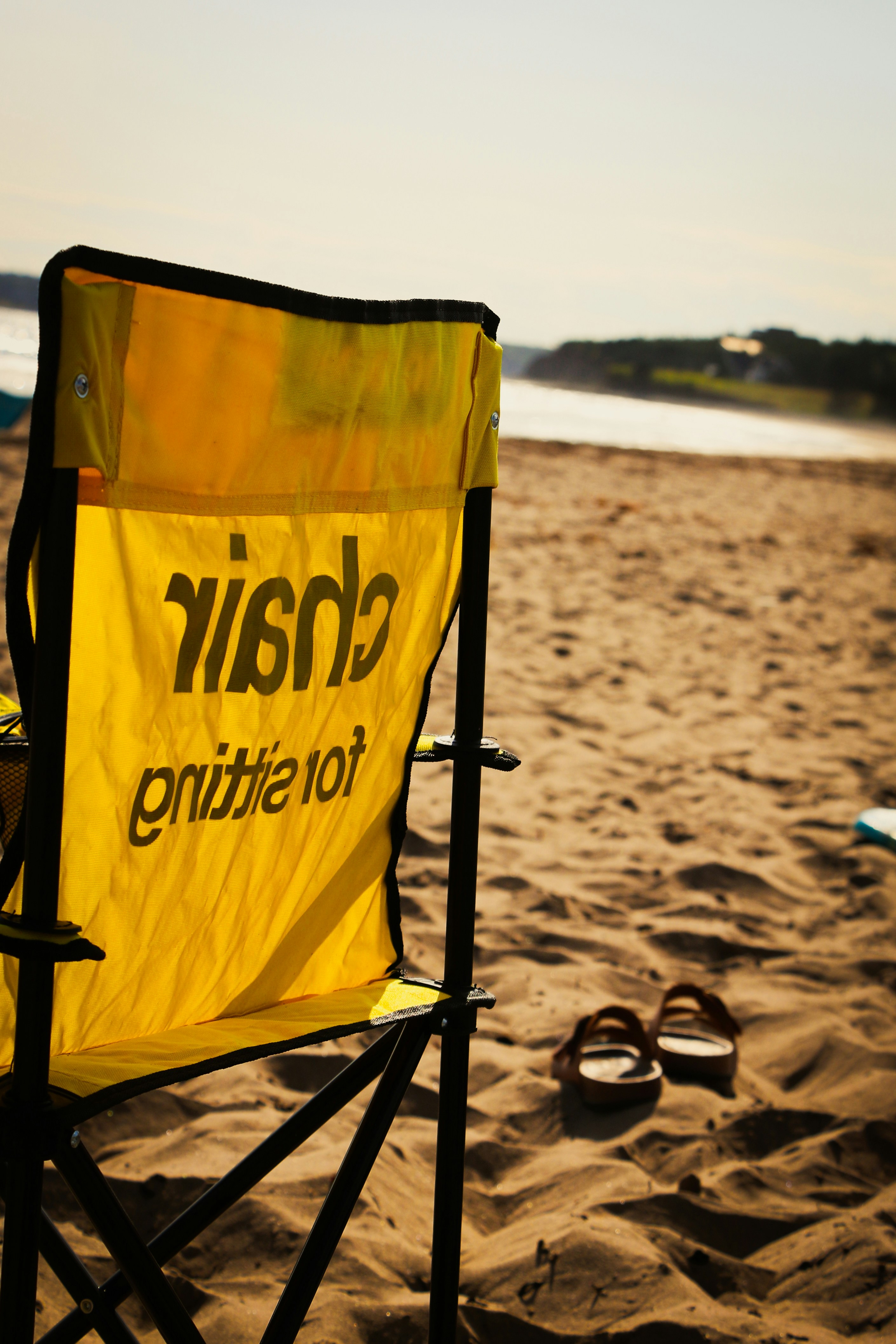 Yellow Beach Chair Silent Guardian over Golden Sands