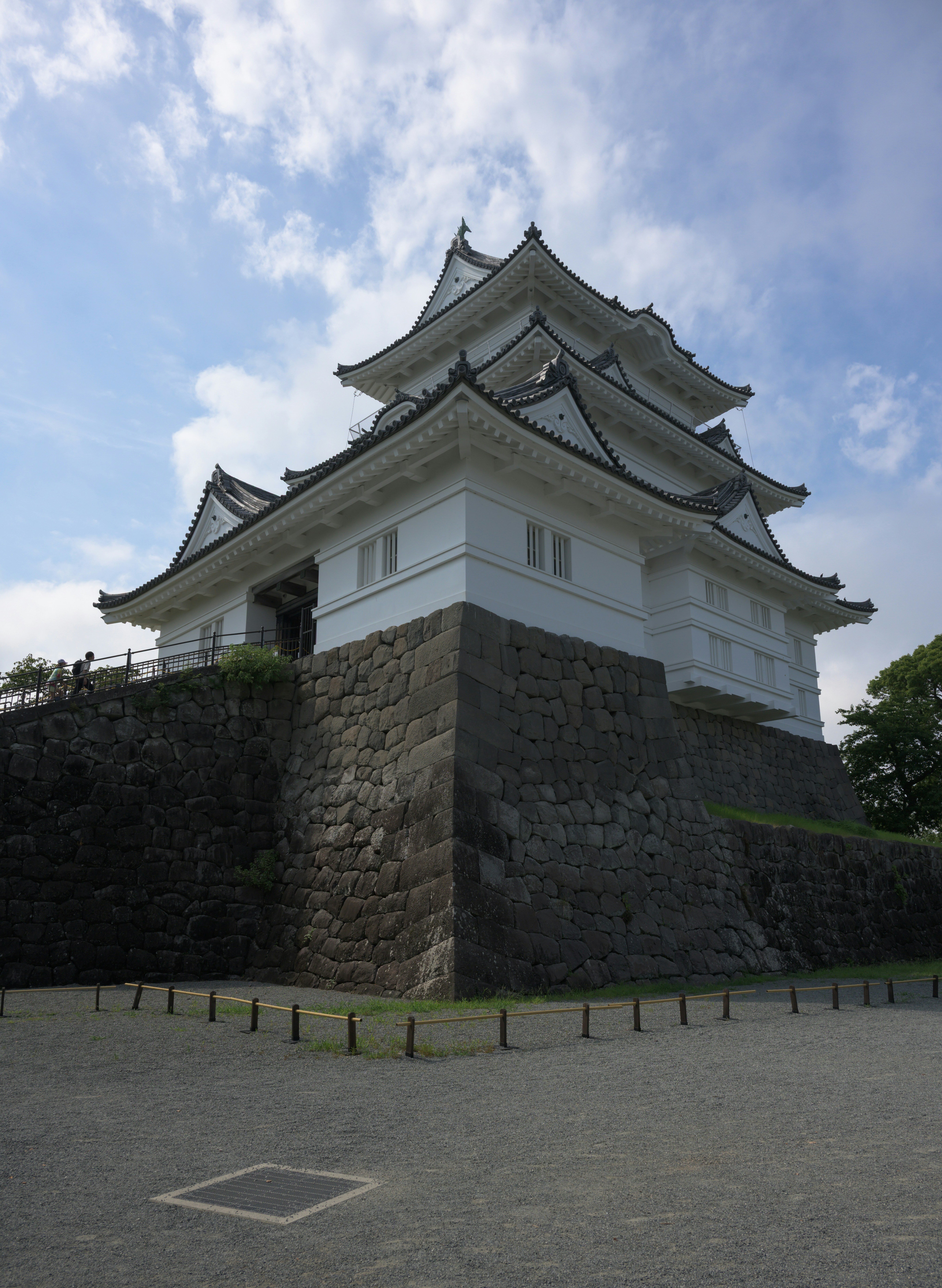 A white japanese castle stands prominently.