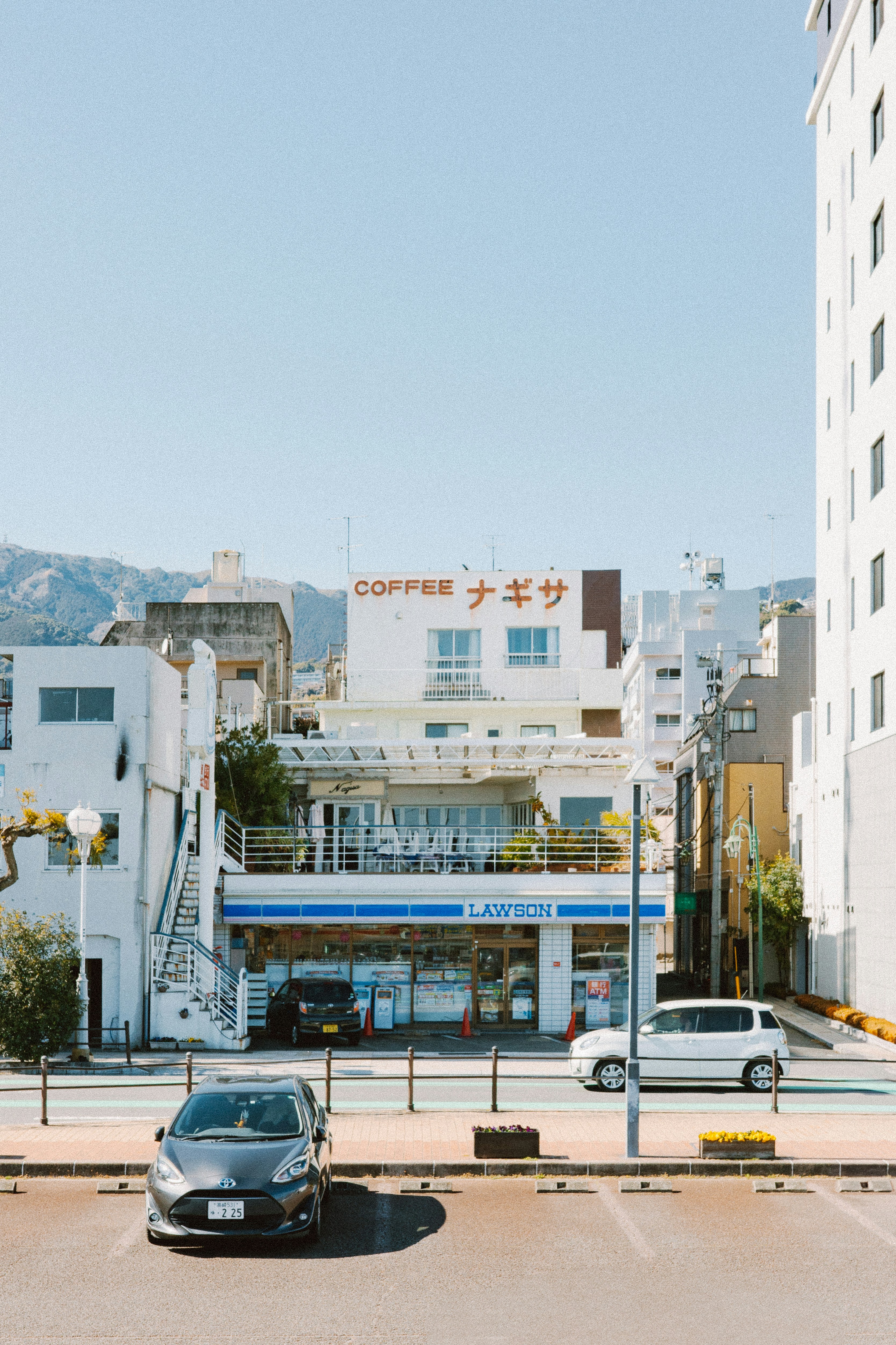Sunlit Coastal Street: A Quiet Urban Sabbath