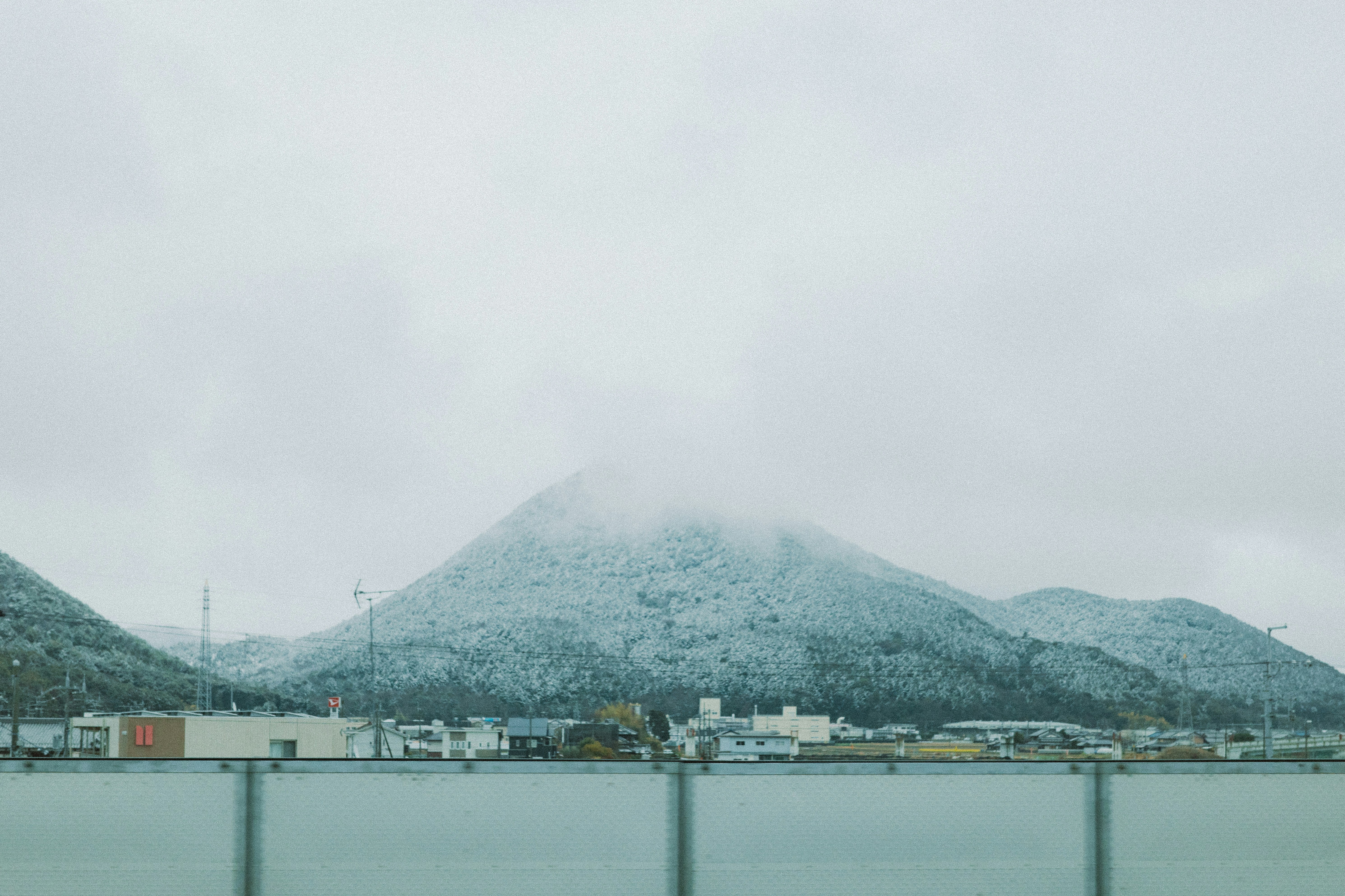 Snowy mountains shrouded in mist.