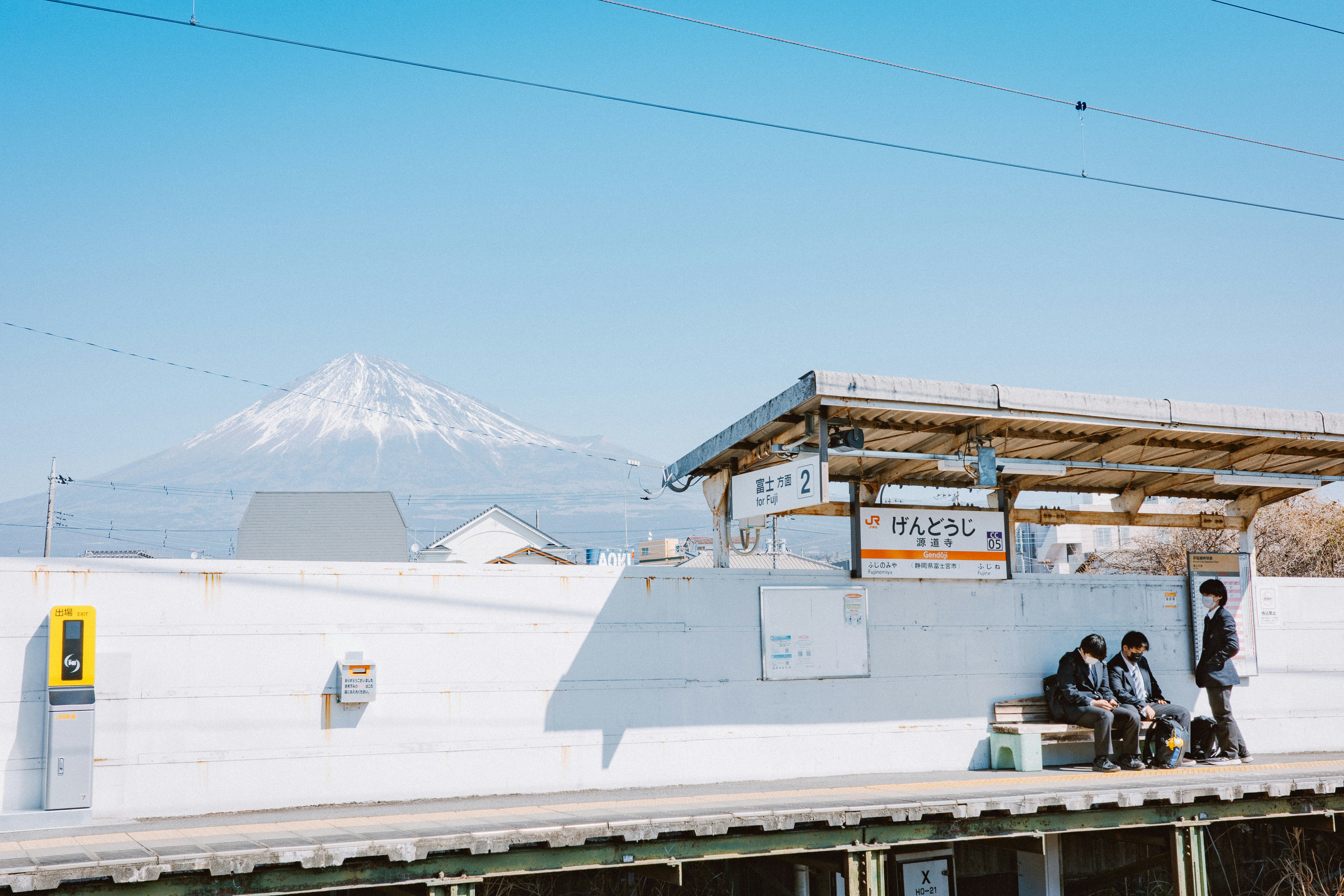 Platform Silence: Snow-capped Peak Behind a Quiet Rural Station