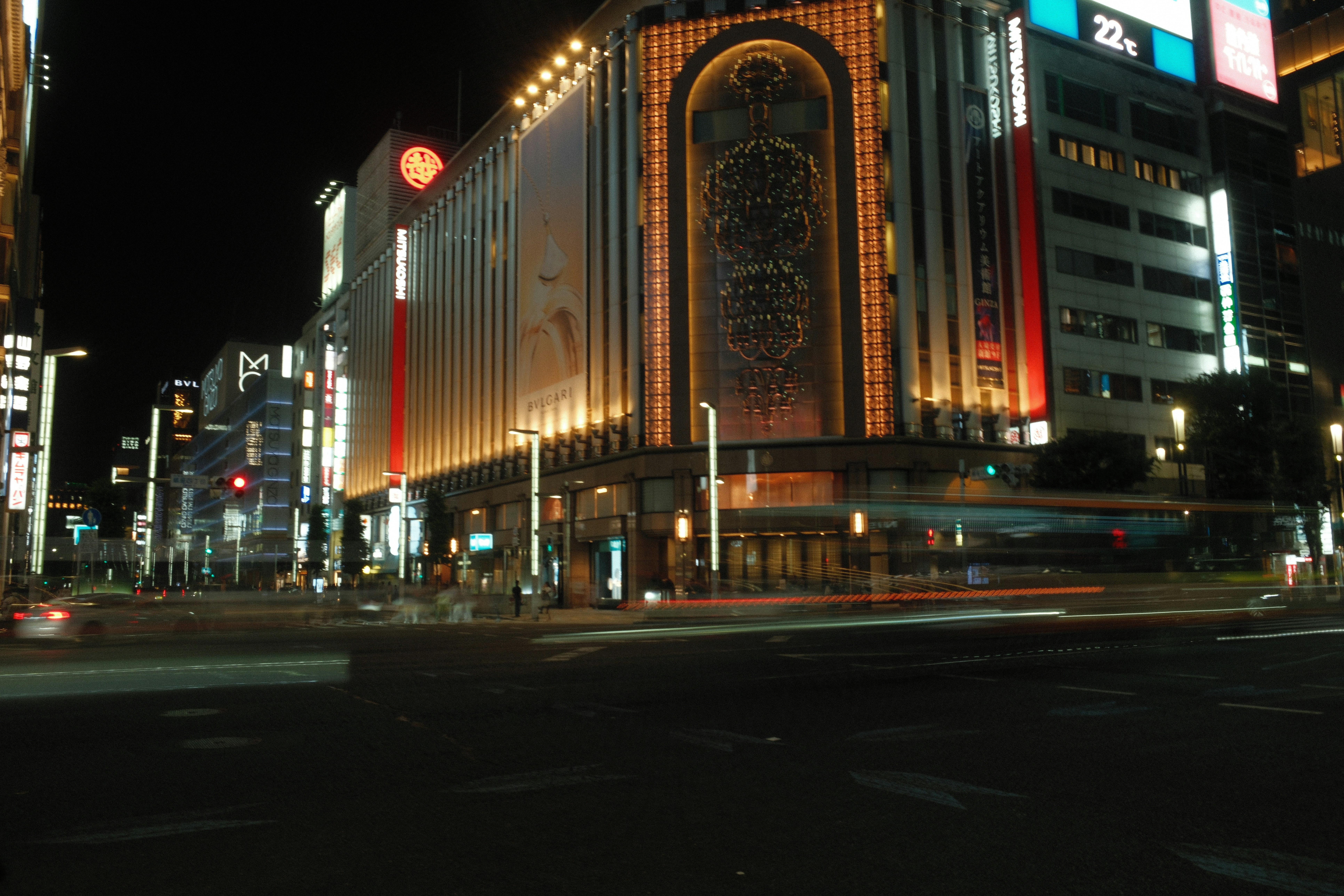 City buildings are illuminated at night.