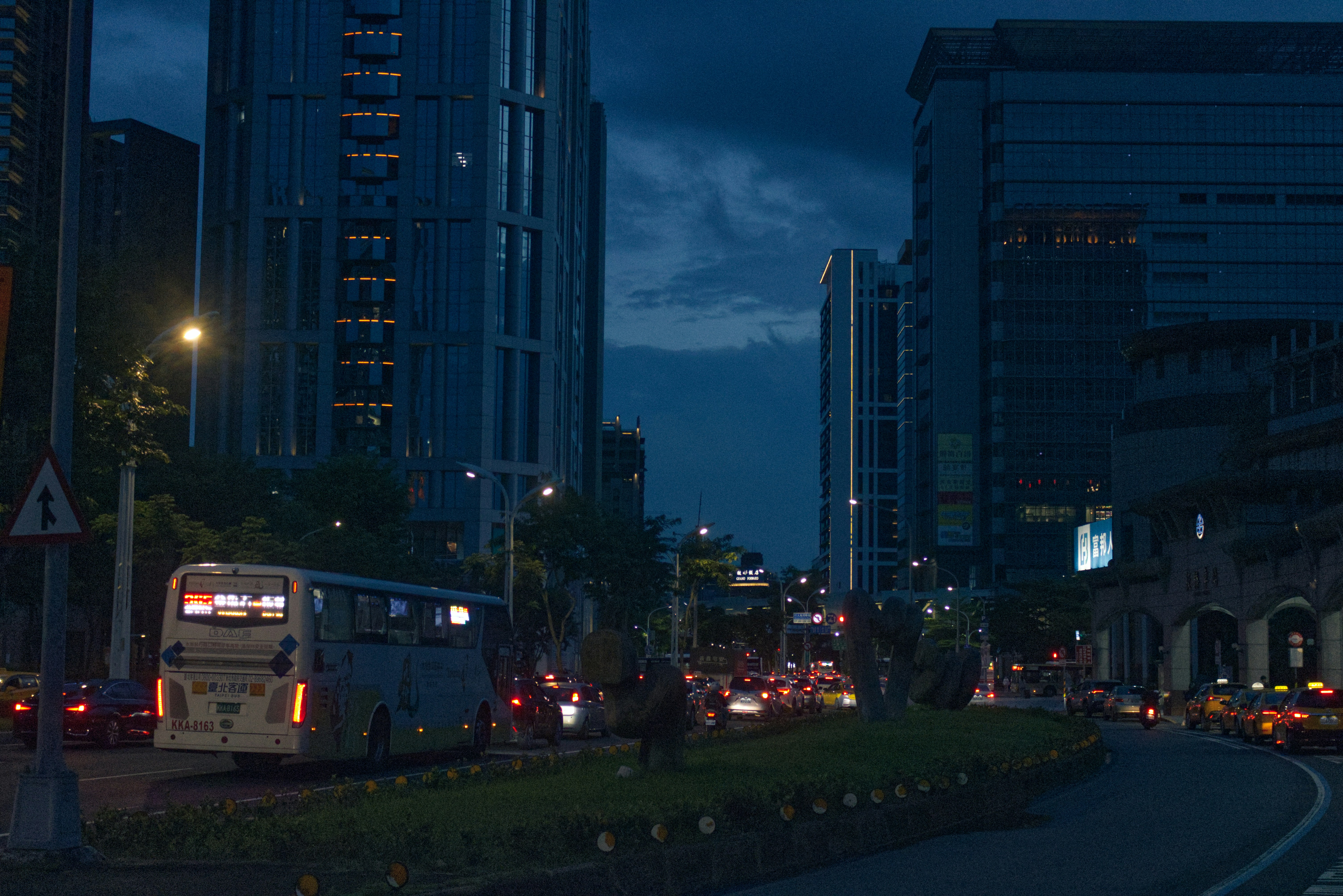 Street at dusk | City street at dusk with traffic and high-rise buildings.