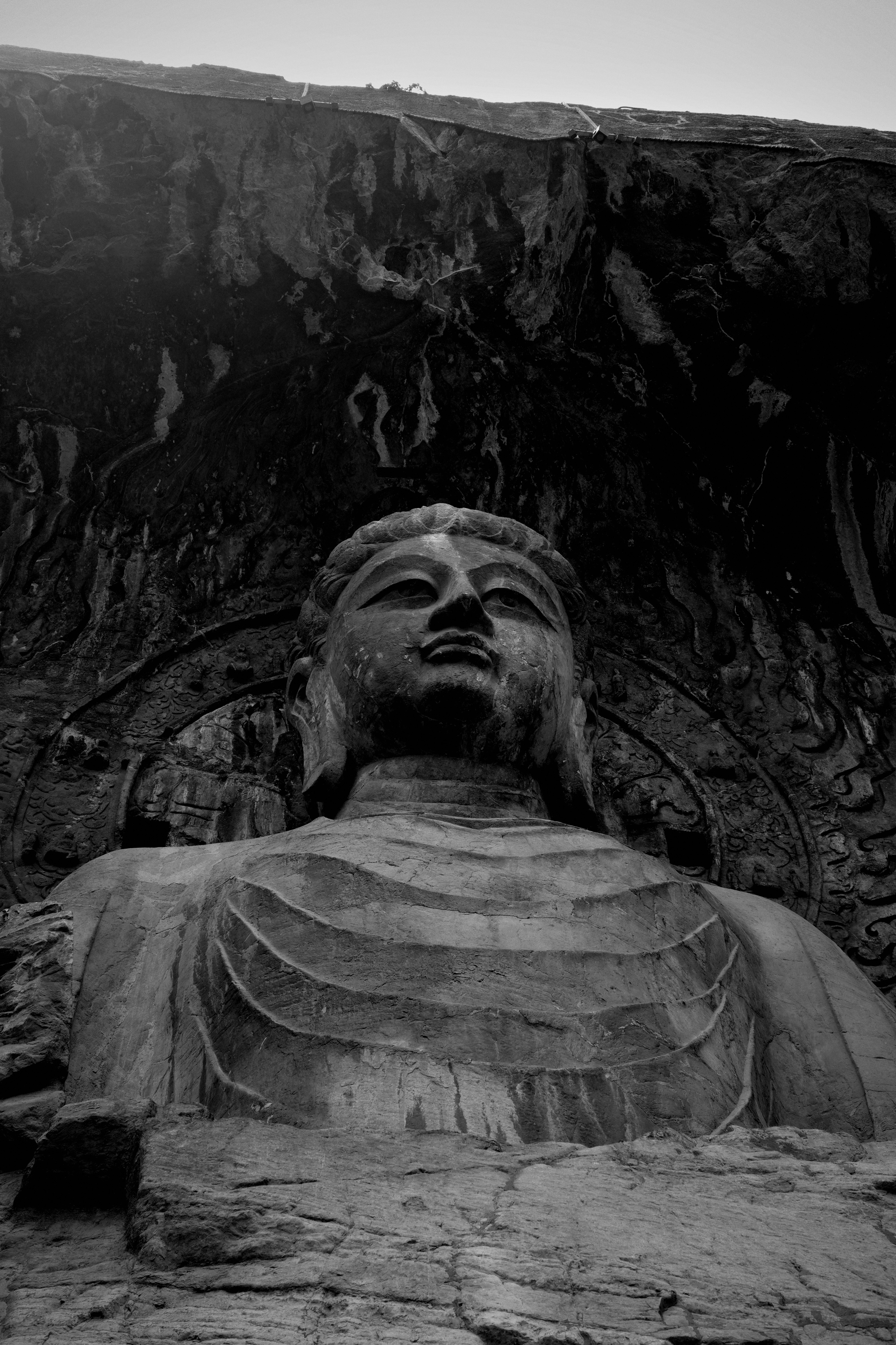 Buddha statue carved into a mountain.