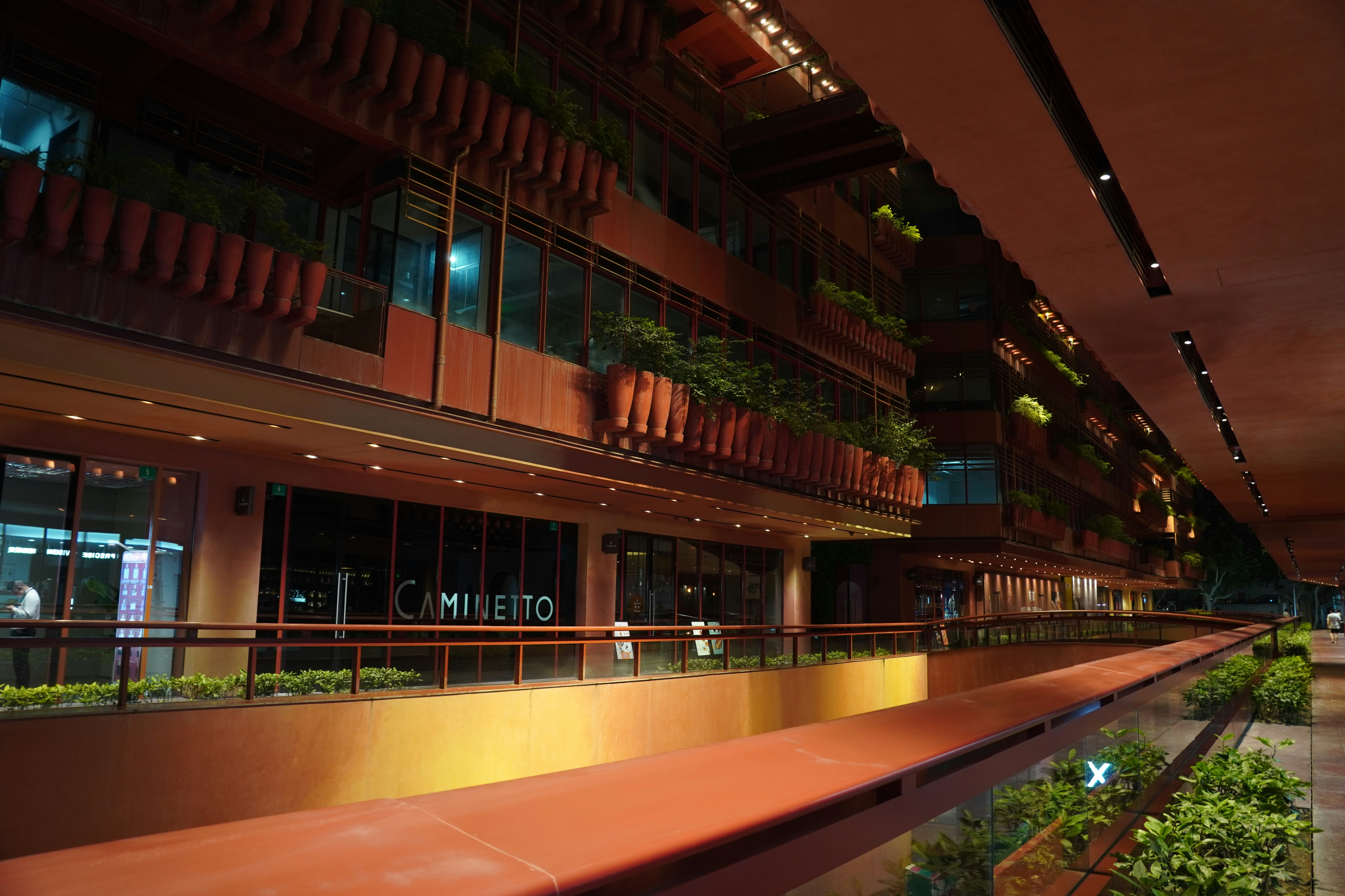 A modern building with outdoor plants.