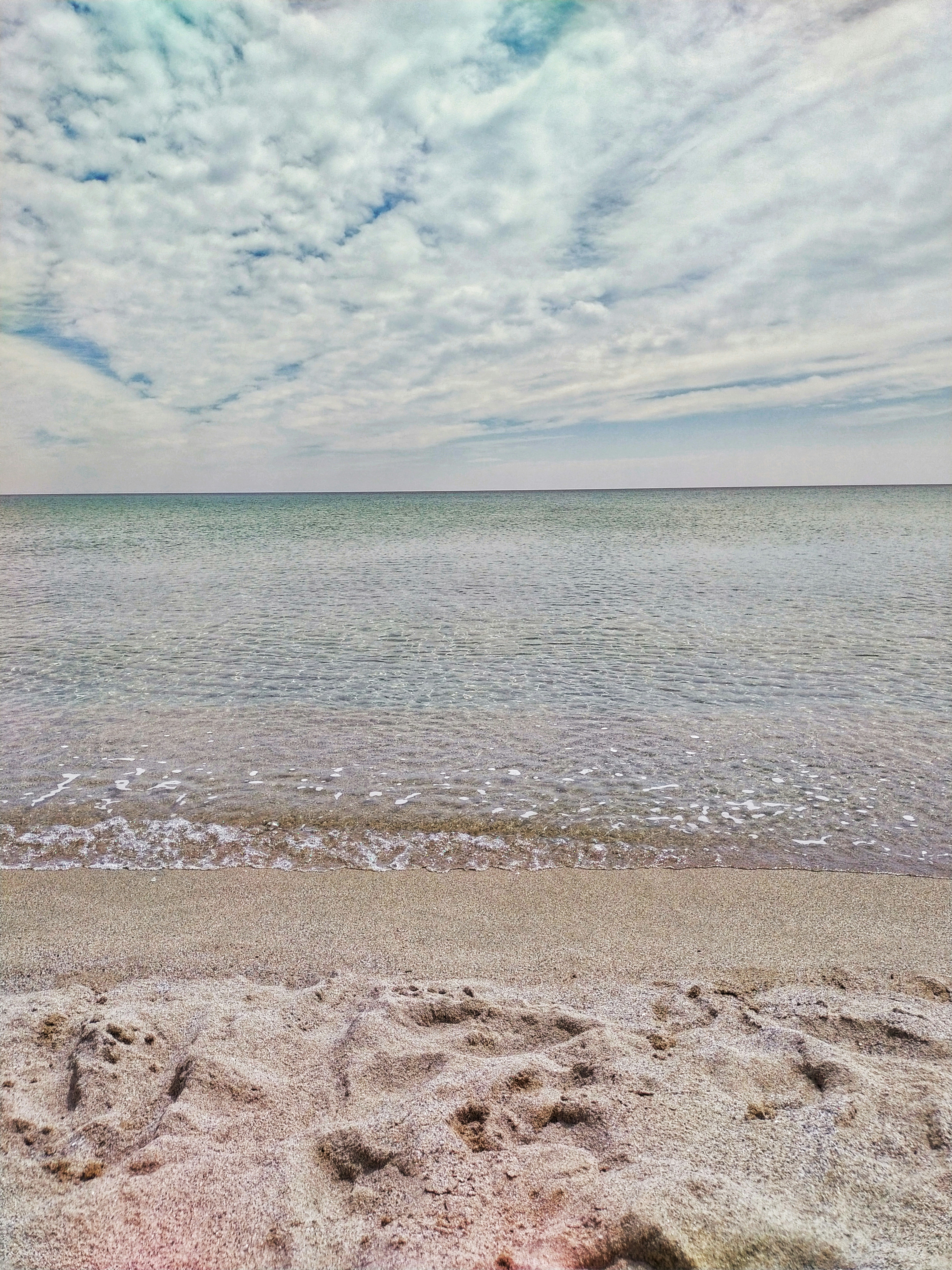 A beautiful beach, sea, and sky.