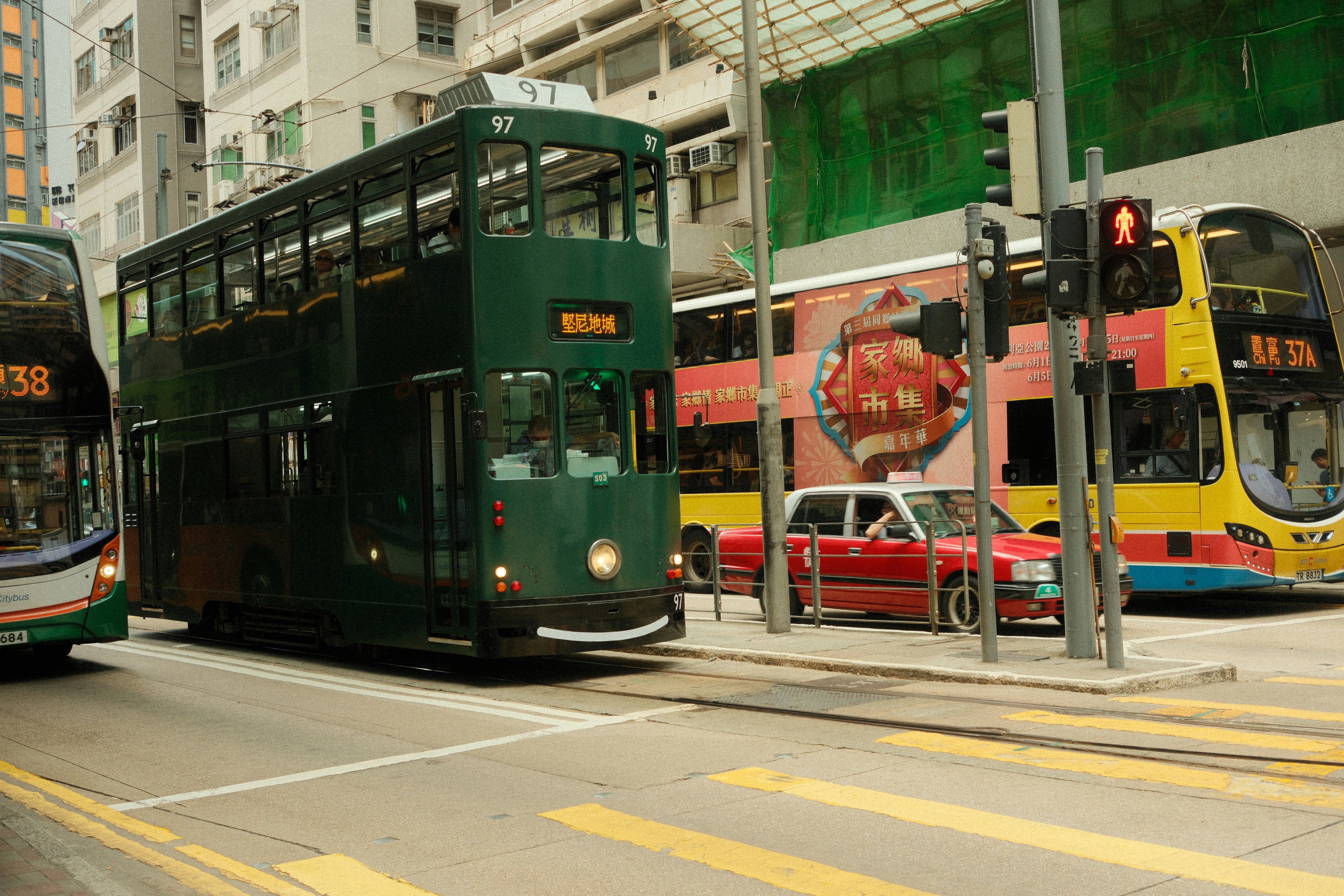 A double-decker tram with other vehicles.