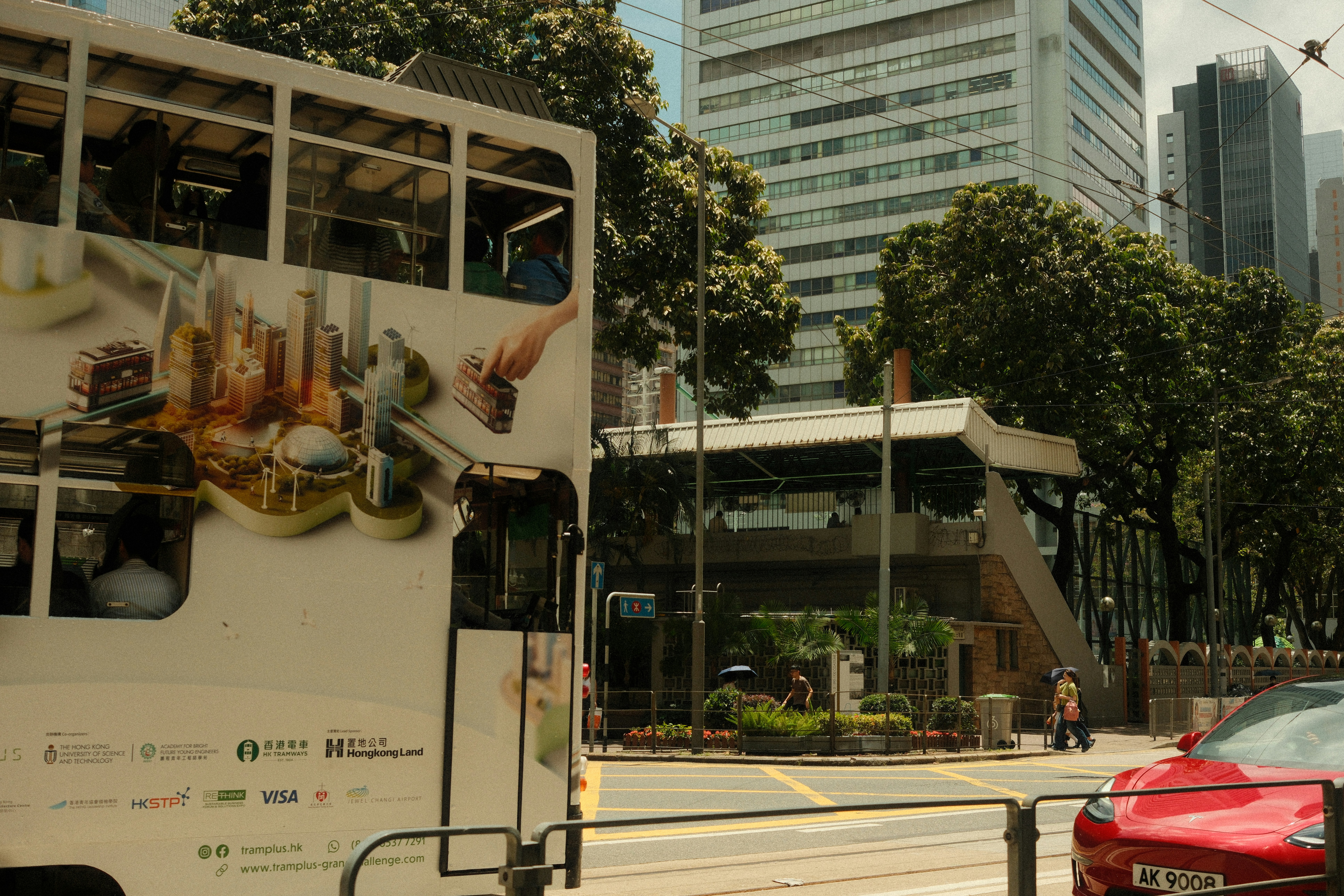 City Bus Stop Portrait: People, Billboards, and Glass Towers