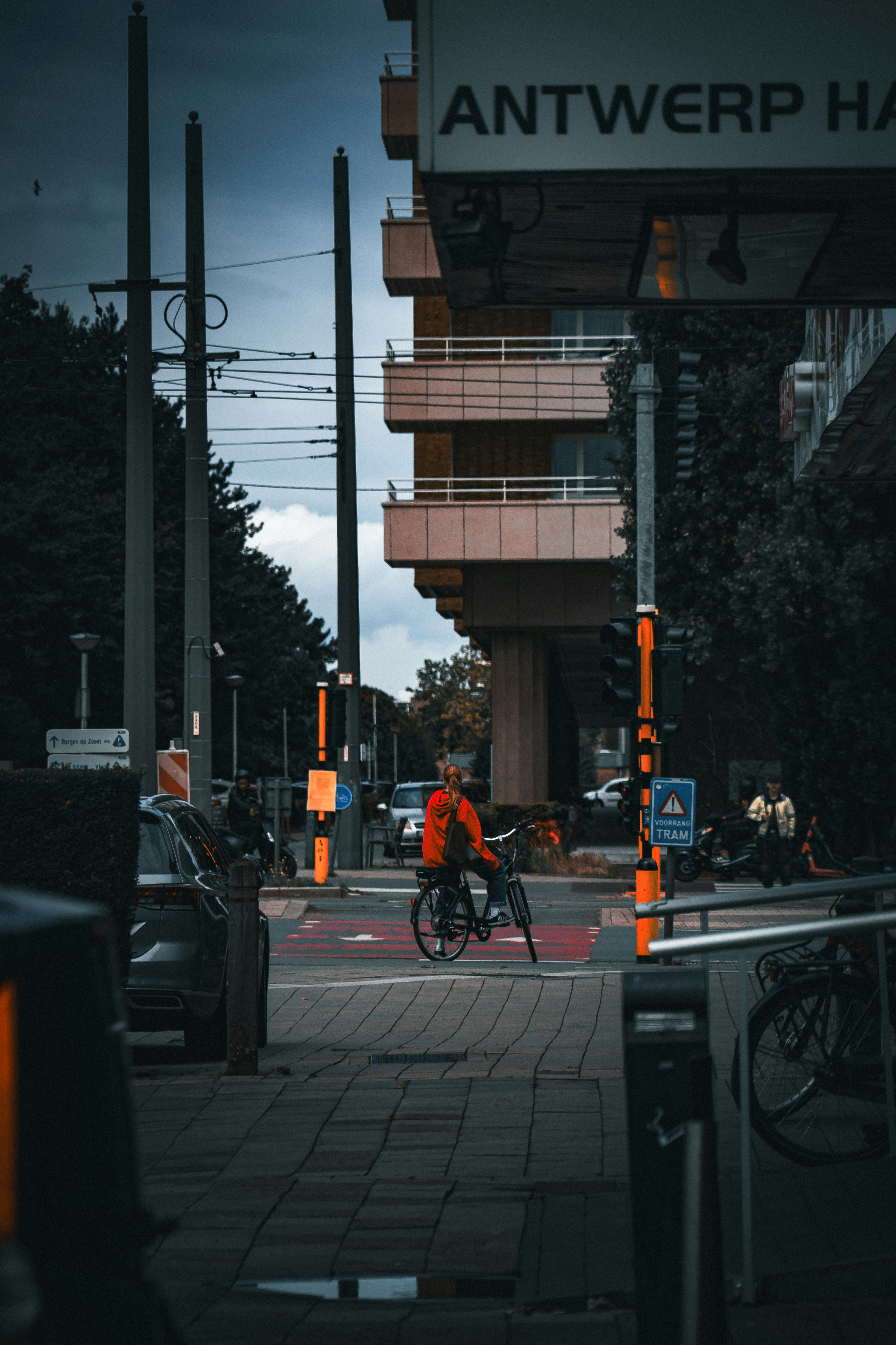 Urban Pulse: A Cyclist's Moment at Antwerp