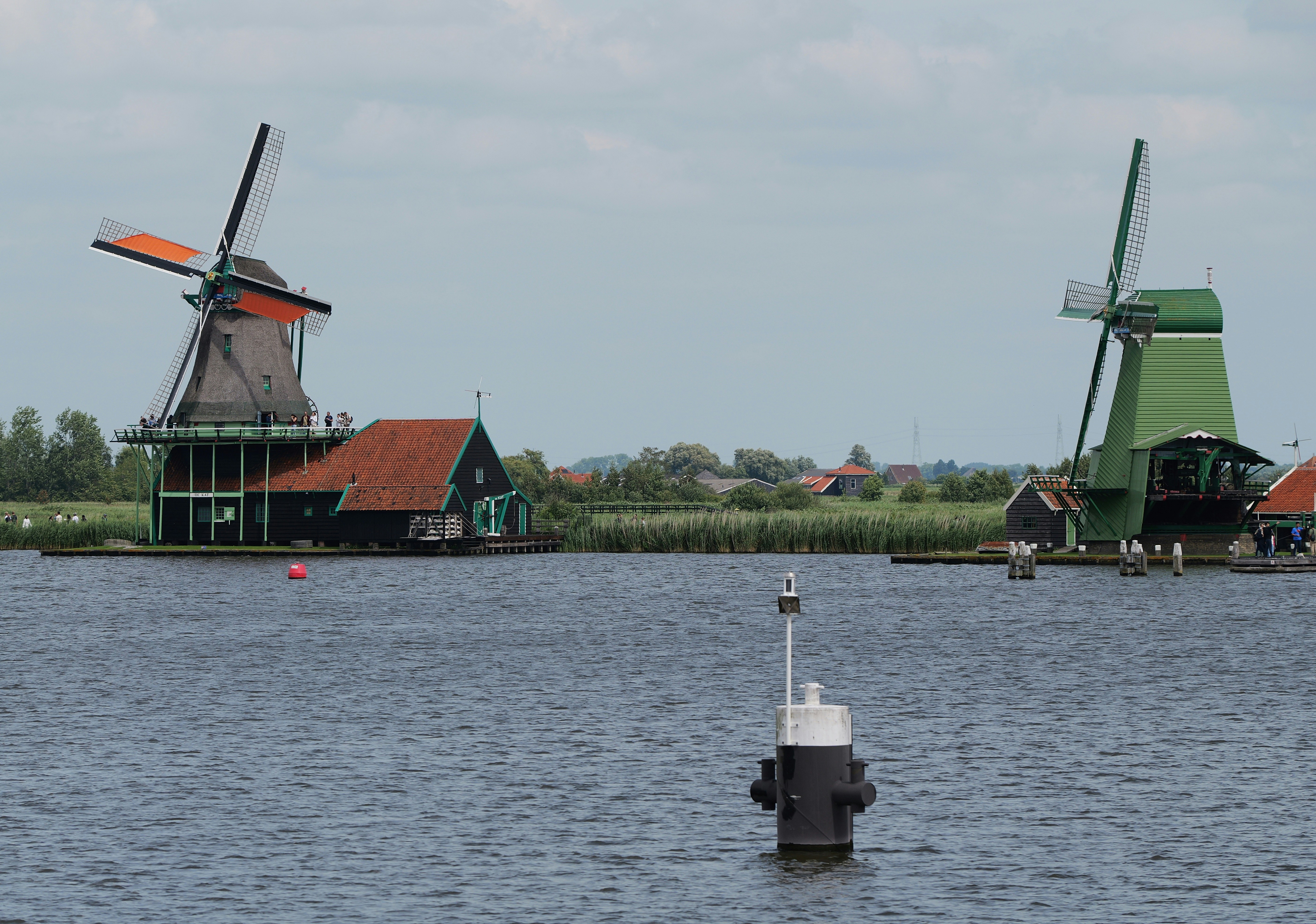 Harmony of Tradition: Windmills by the Water