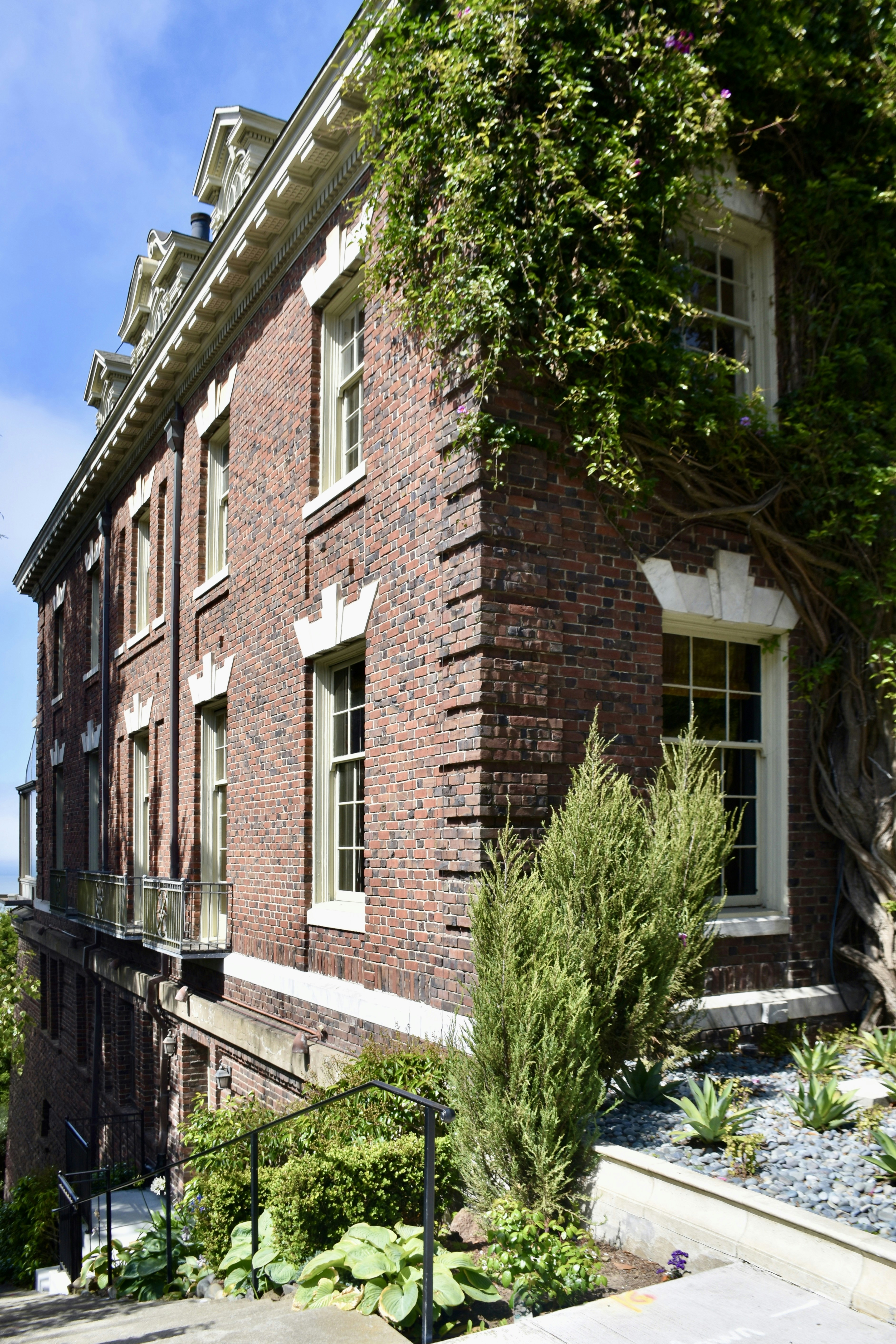 Great housing and views in San Franciscos most beautiful area | A brick building covered with ivy.