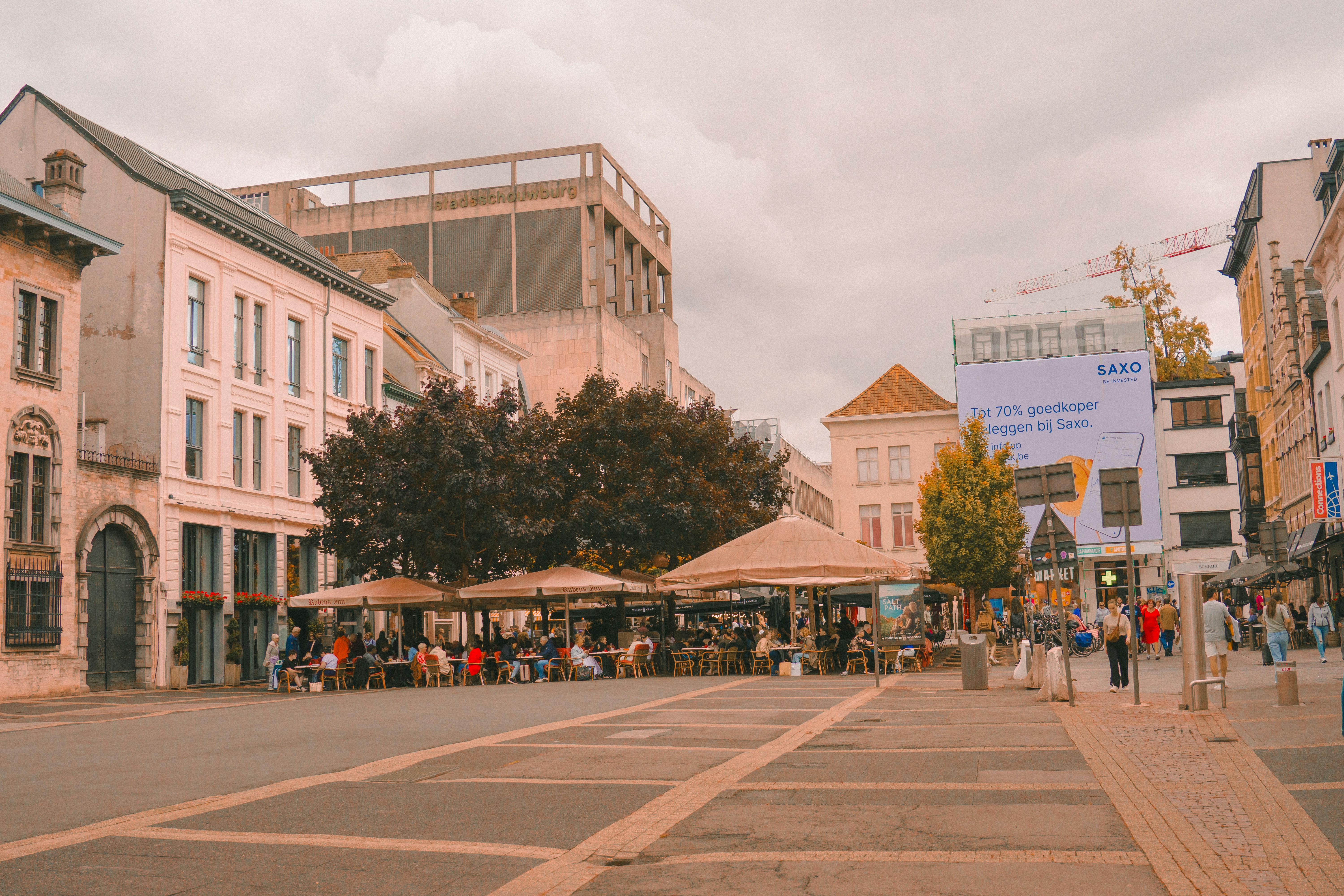 A city square filled with buildings and people.