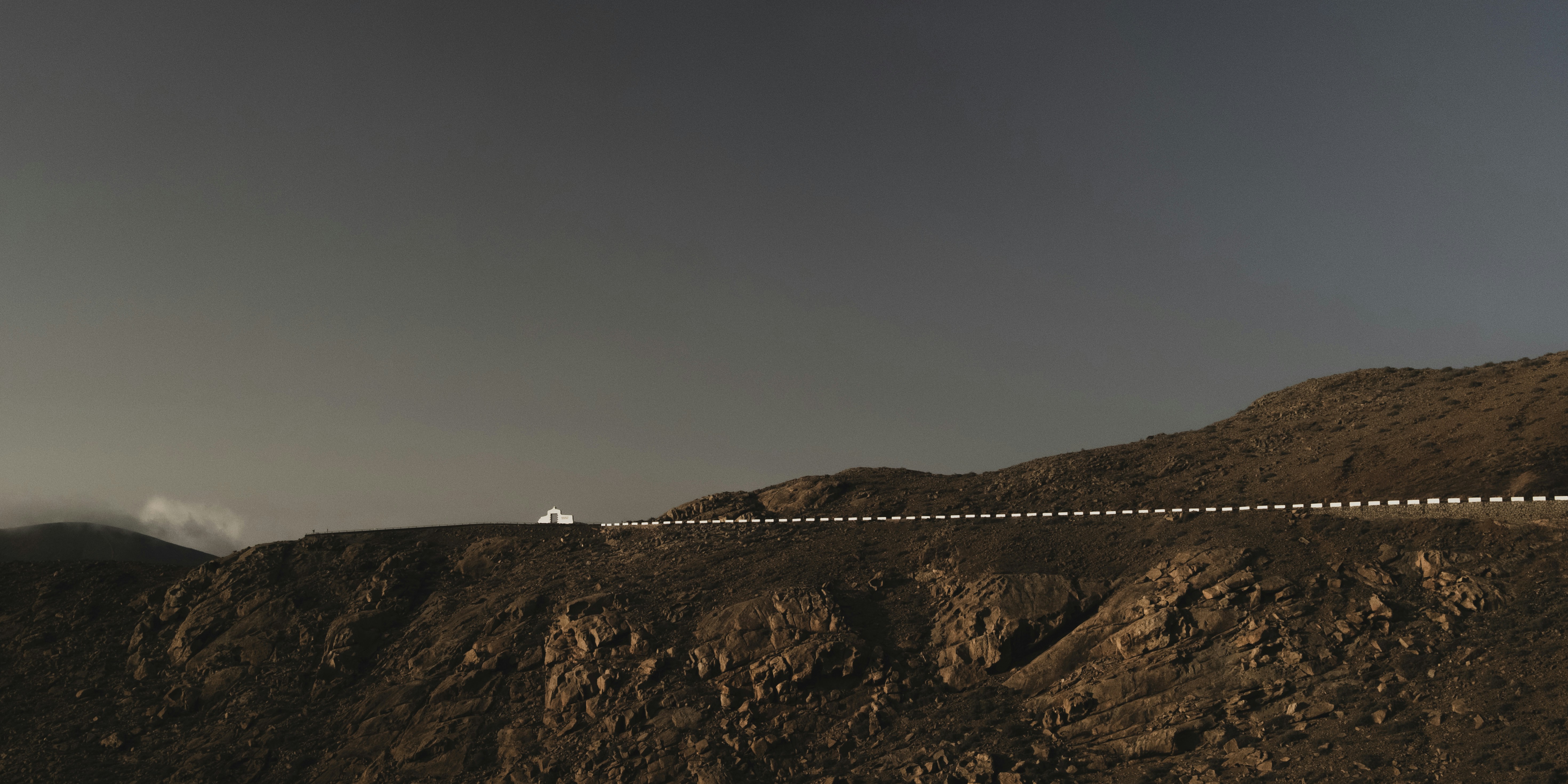 Dusk Ridge: A Line of Distant Lights Tracing the Horizon