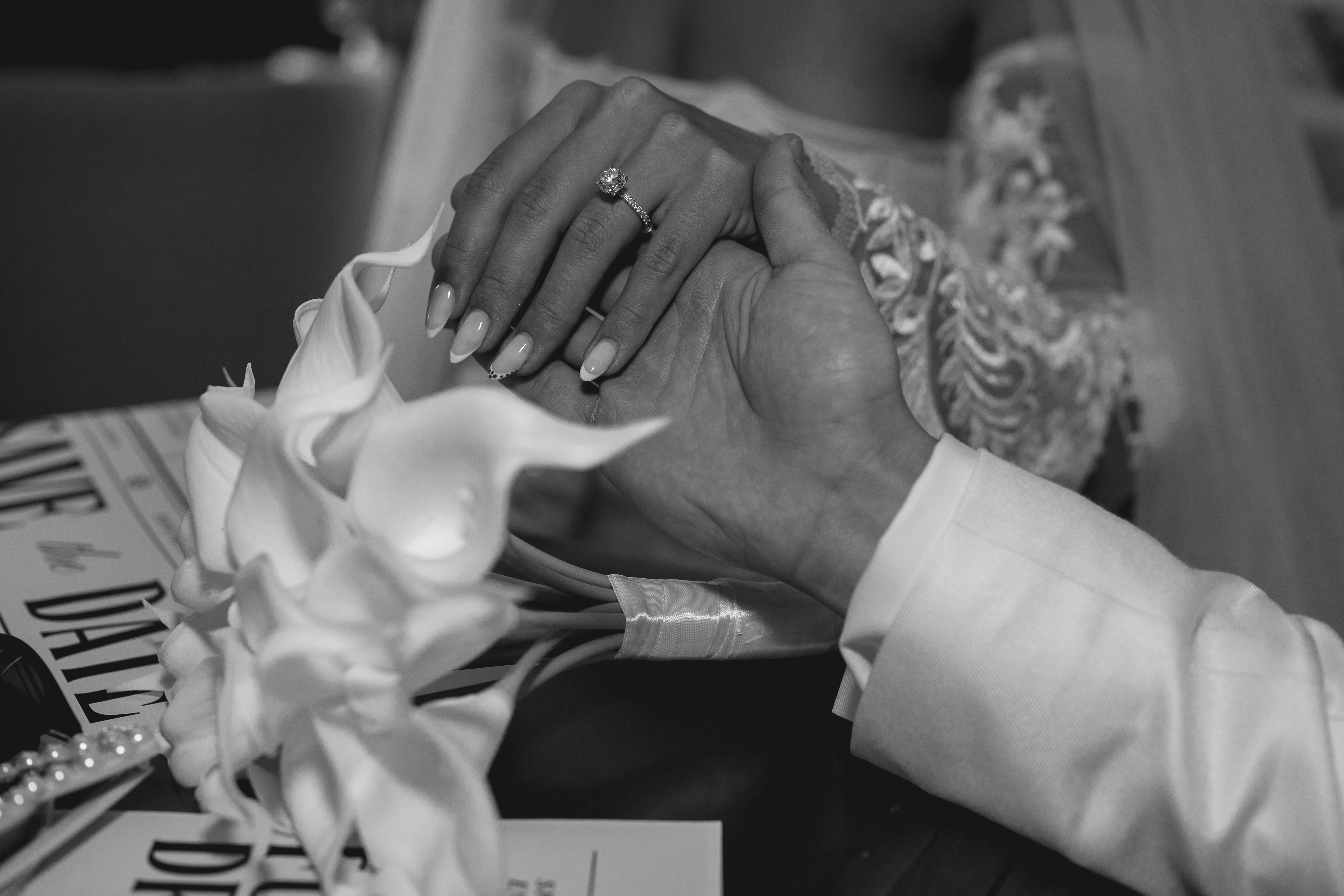 Bride and groom holding hands at their wedding.