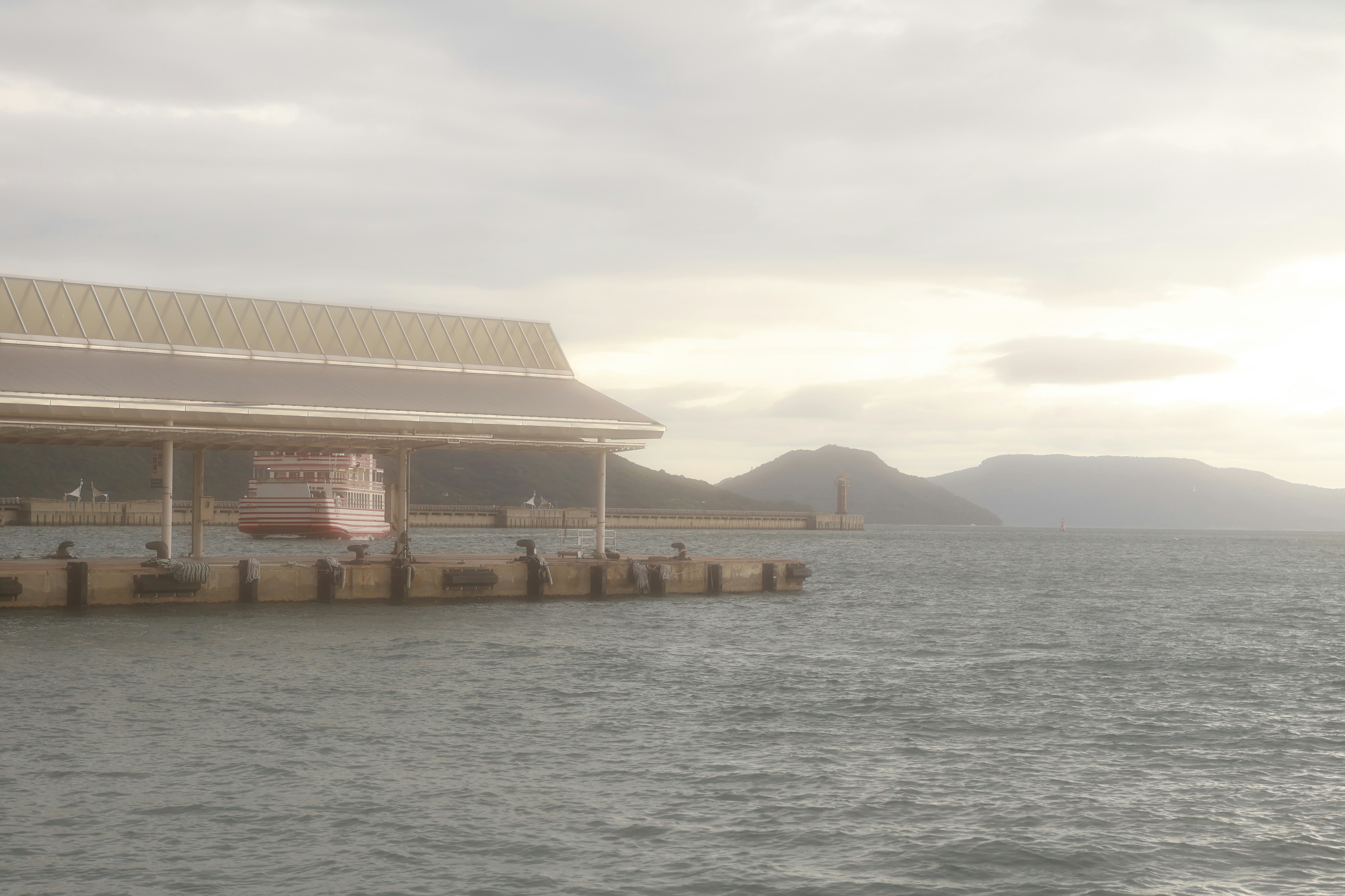 A boat is docked at the pier in the evening.