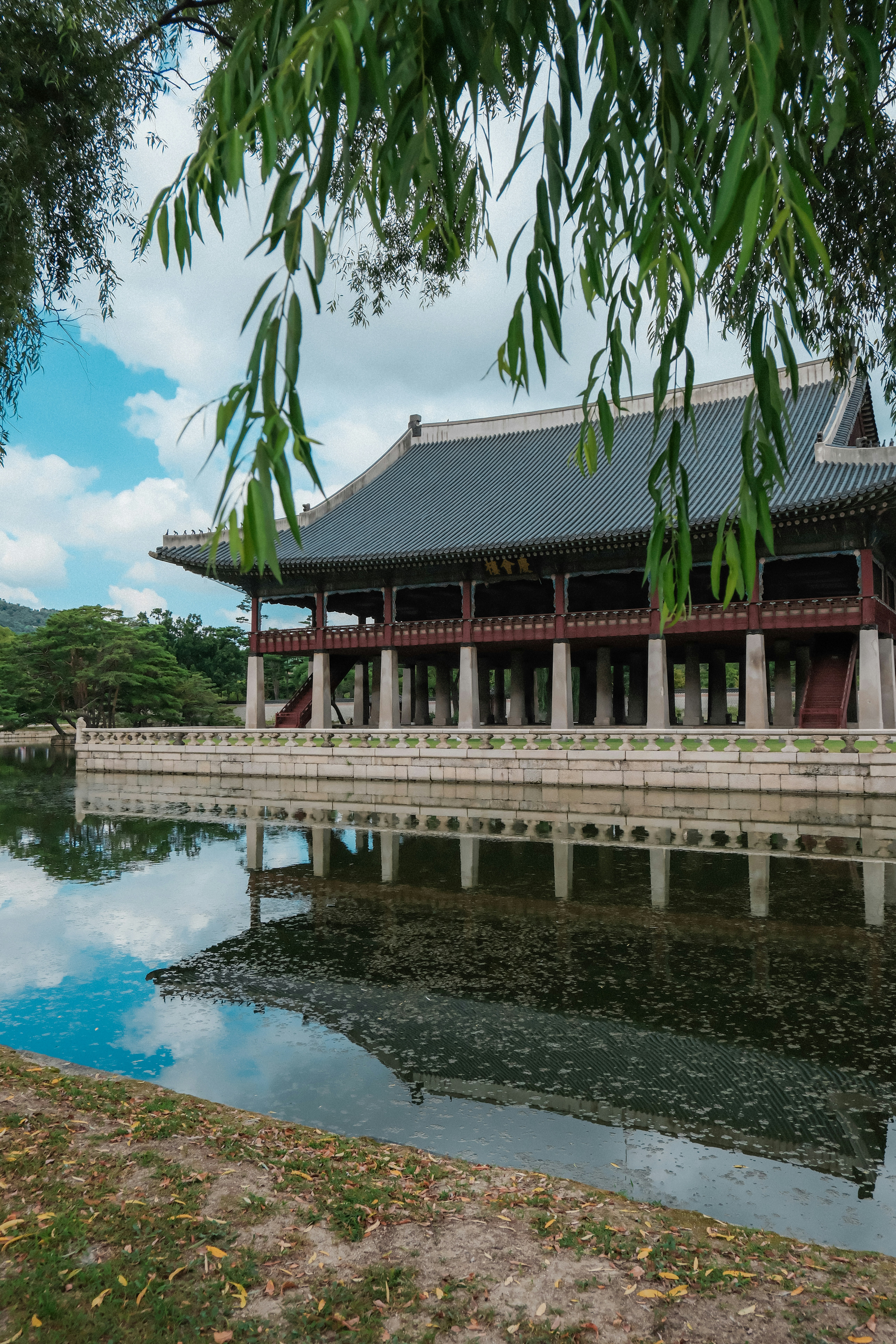 Traditional korean building and reflection in water.