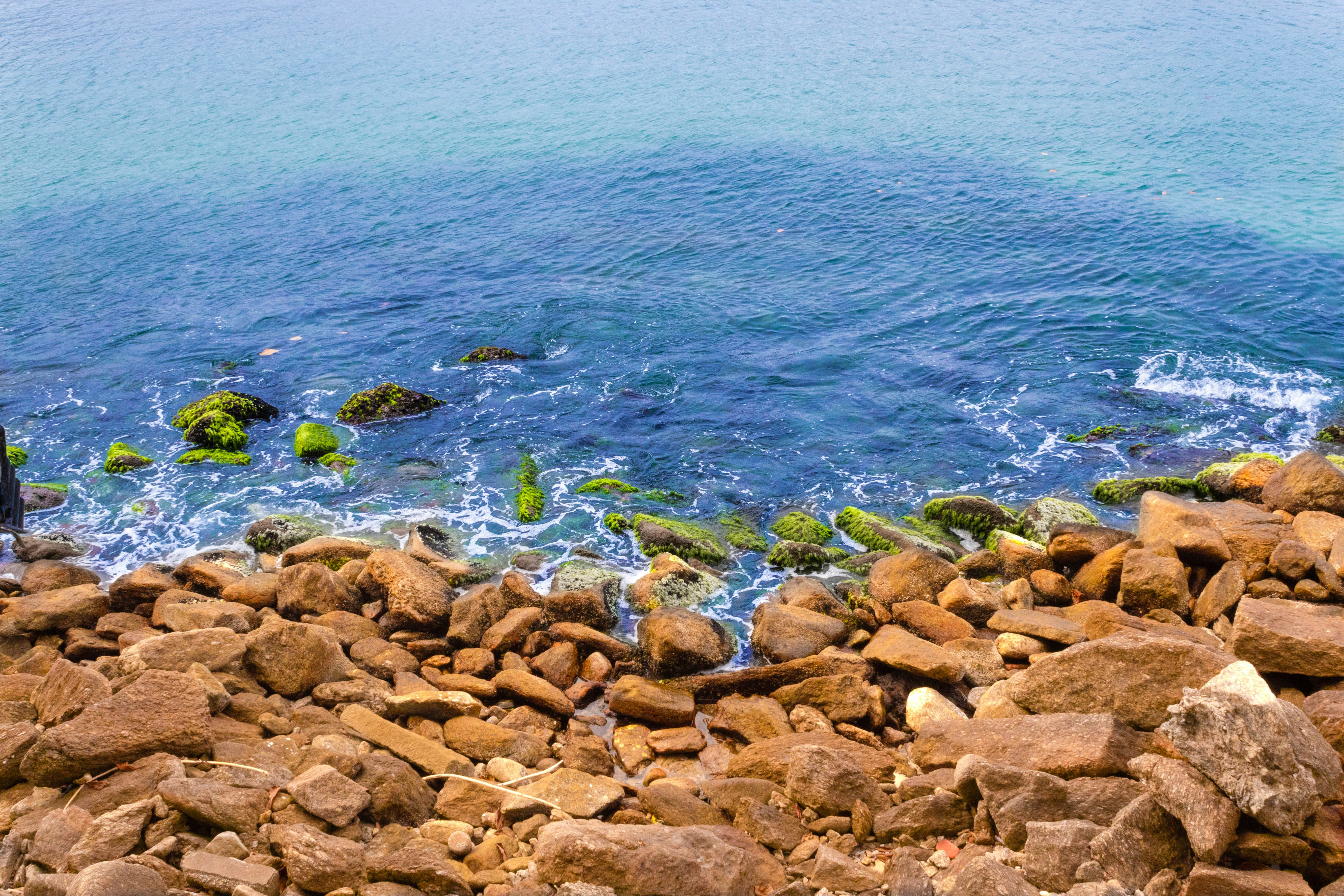 Rocks and the sea meet in a beautiful coastal view.