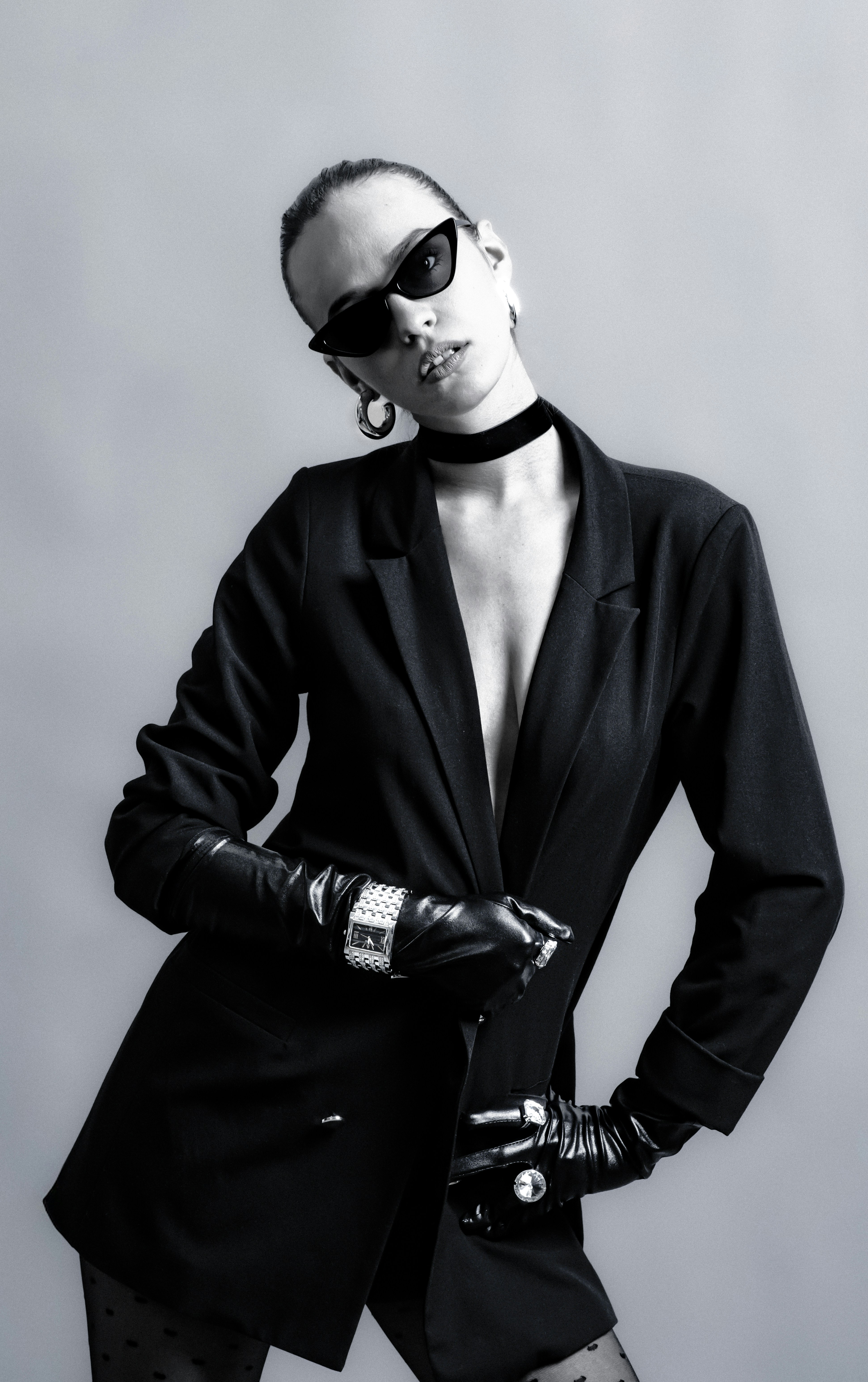 A stylish person poses in a black blazer.